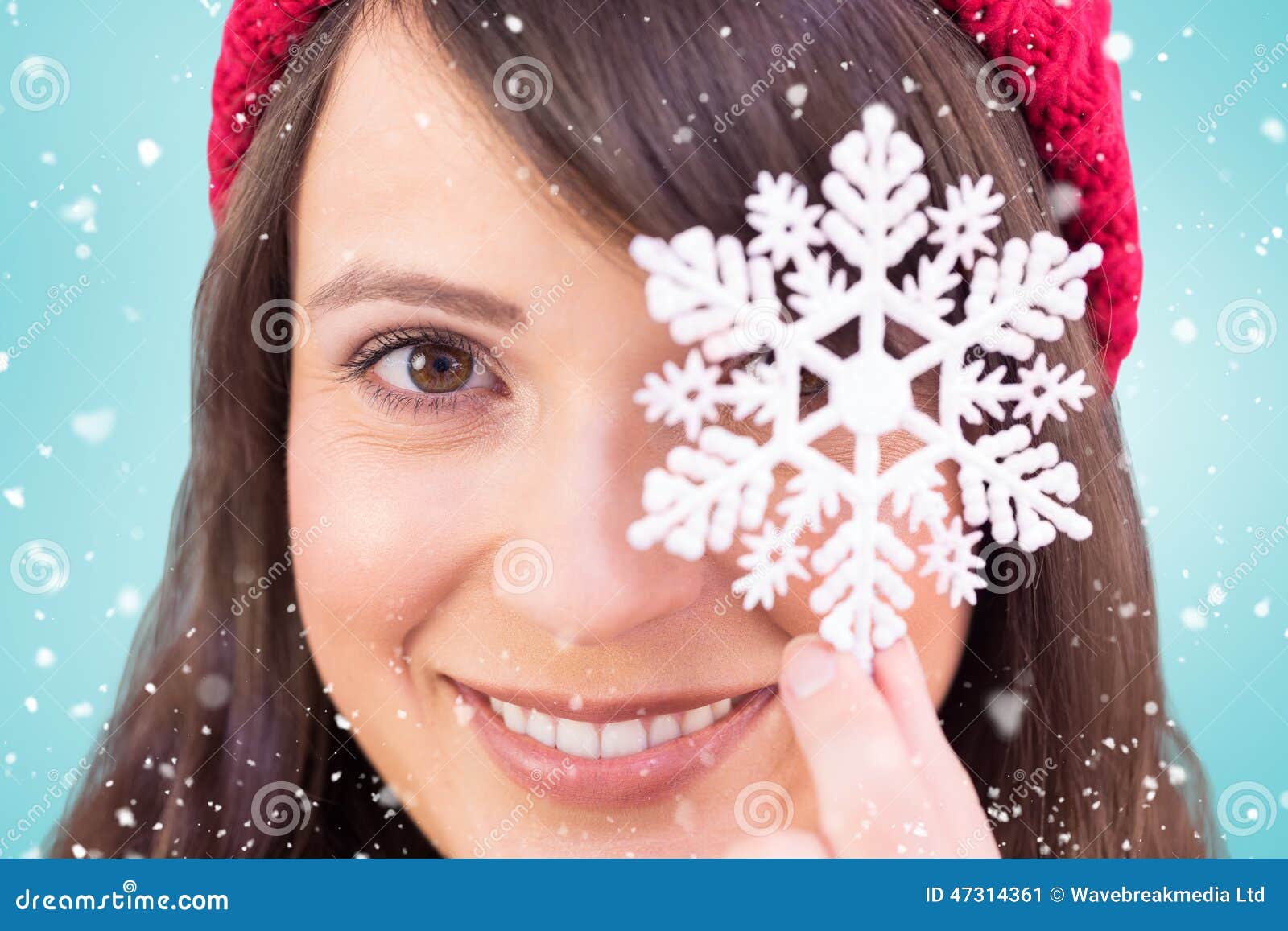 Composite Image of Festive Brunette Holding Snowflake Decoration Stock ...