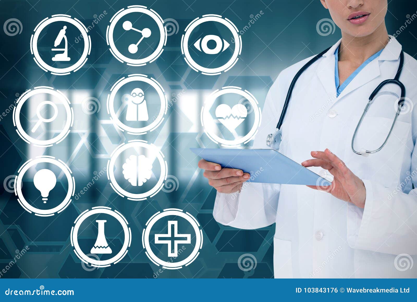 Composite Image of Focused Doctor Using Her Tablet Pc Stock Photo ...