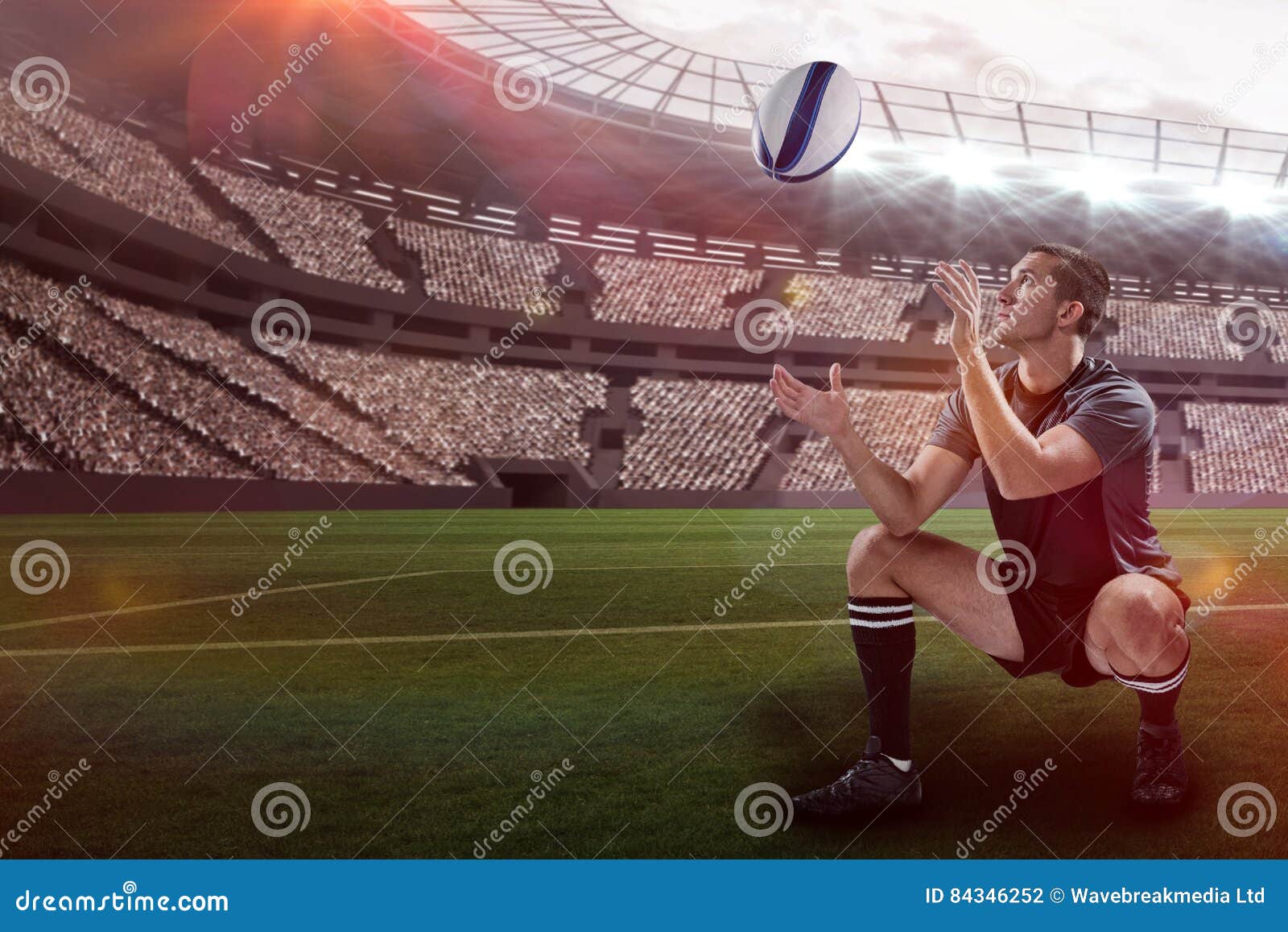 Composite Image of Full Length of Rugby Player Catching the Ball with ...