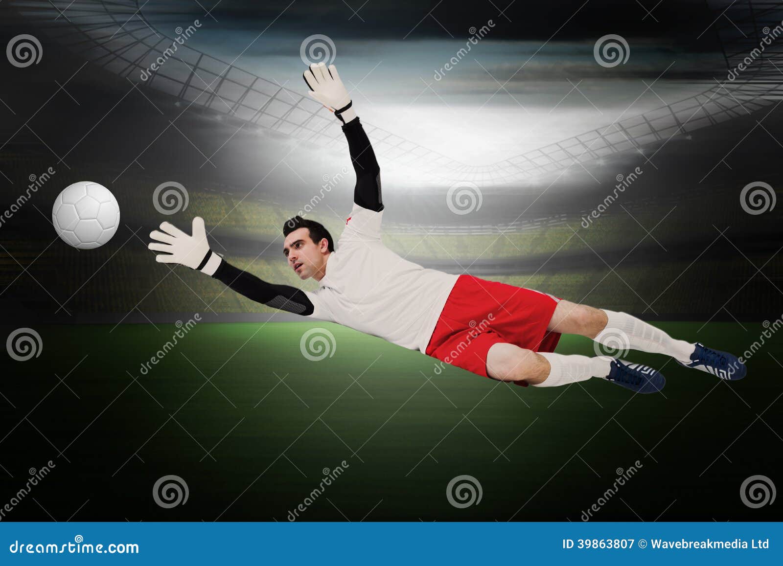 Composite Image of Goalkeeper in White Making a Save Stock Image ...