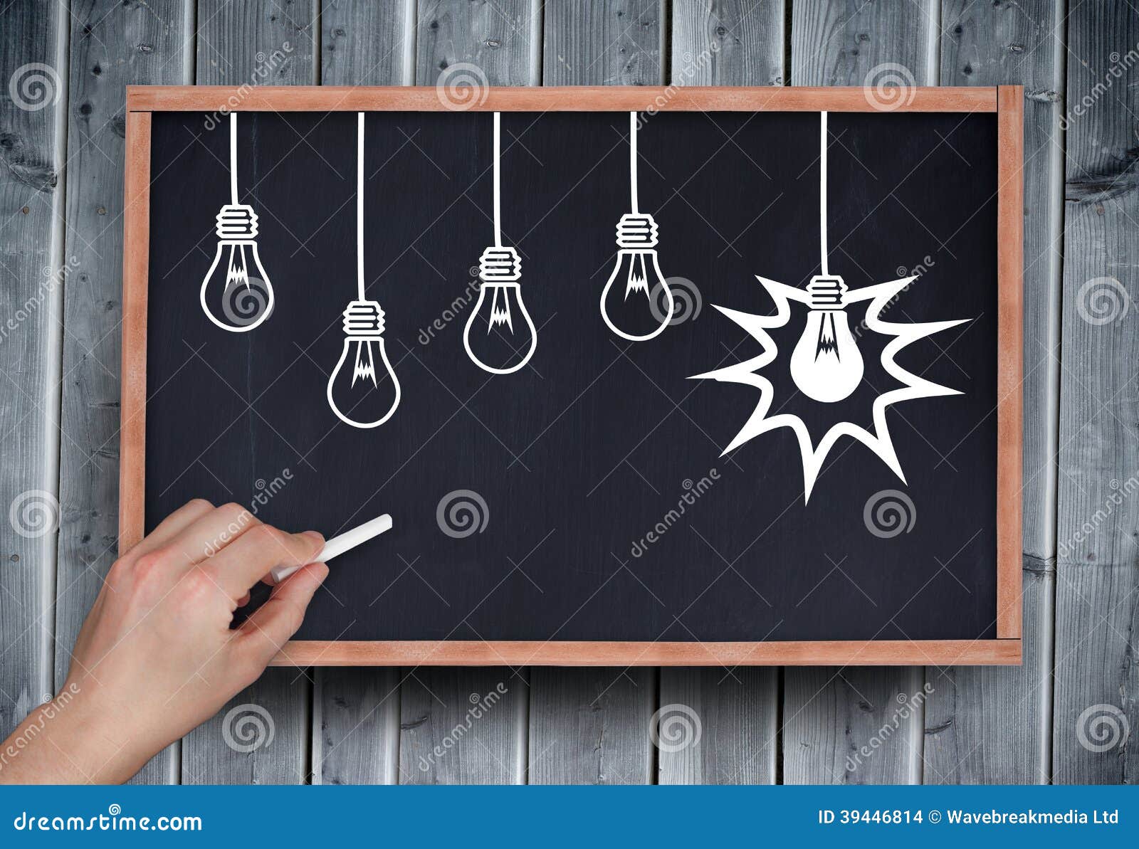 Composite Image of Hand Drawing Light Bulbs with Chalk Stock Photo ...