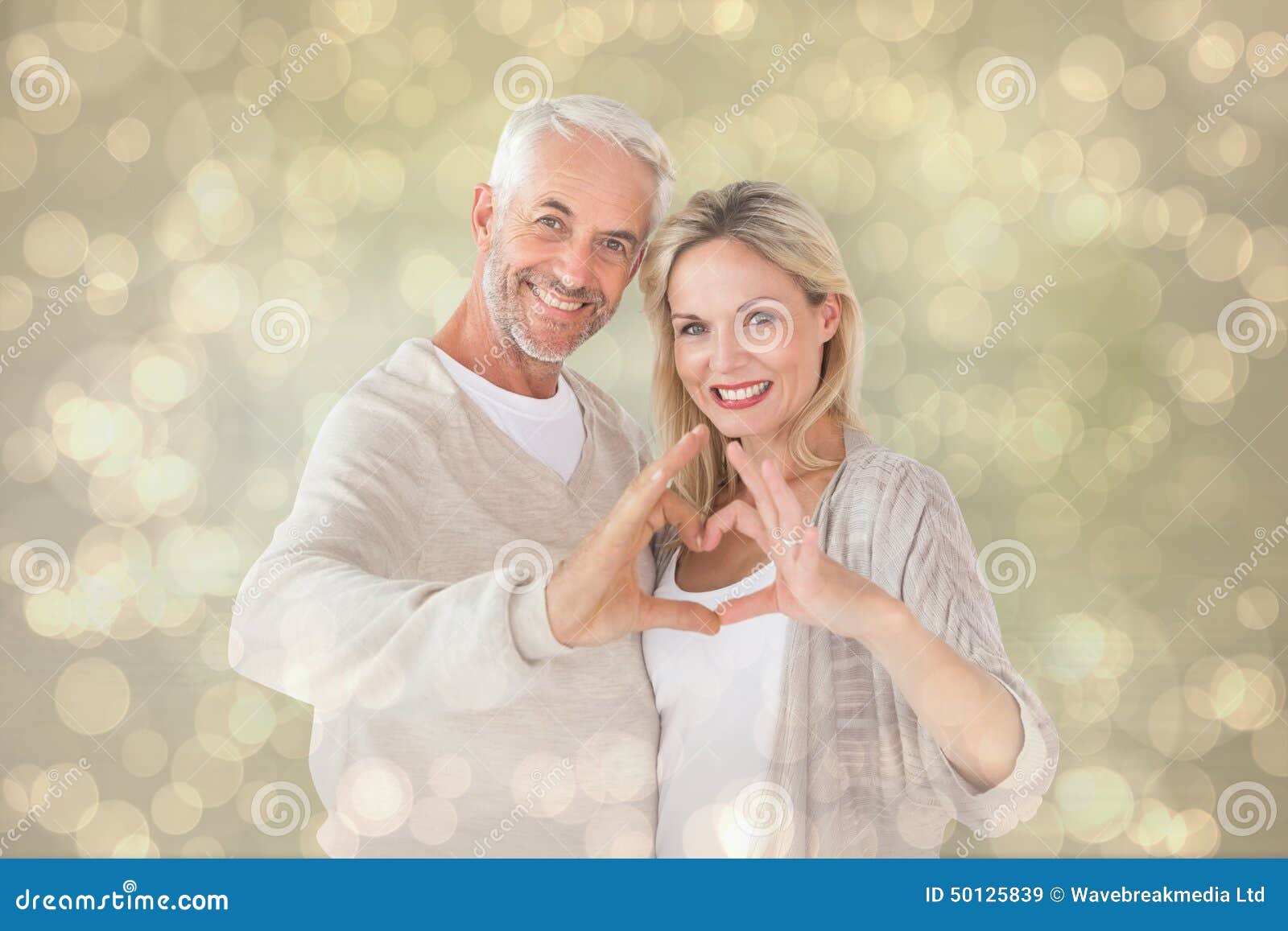 Composite Image of Happy Couple Forming Heart Shape with Hands Stock ...