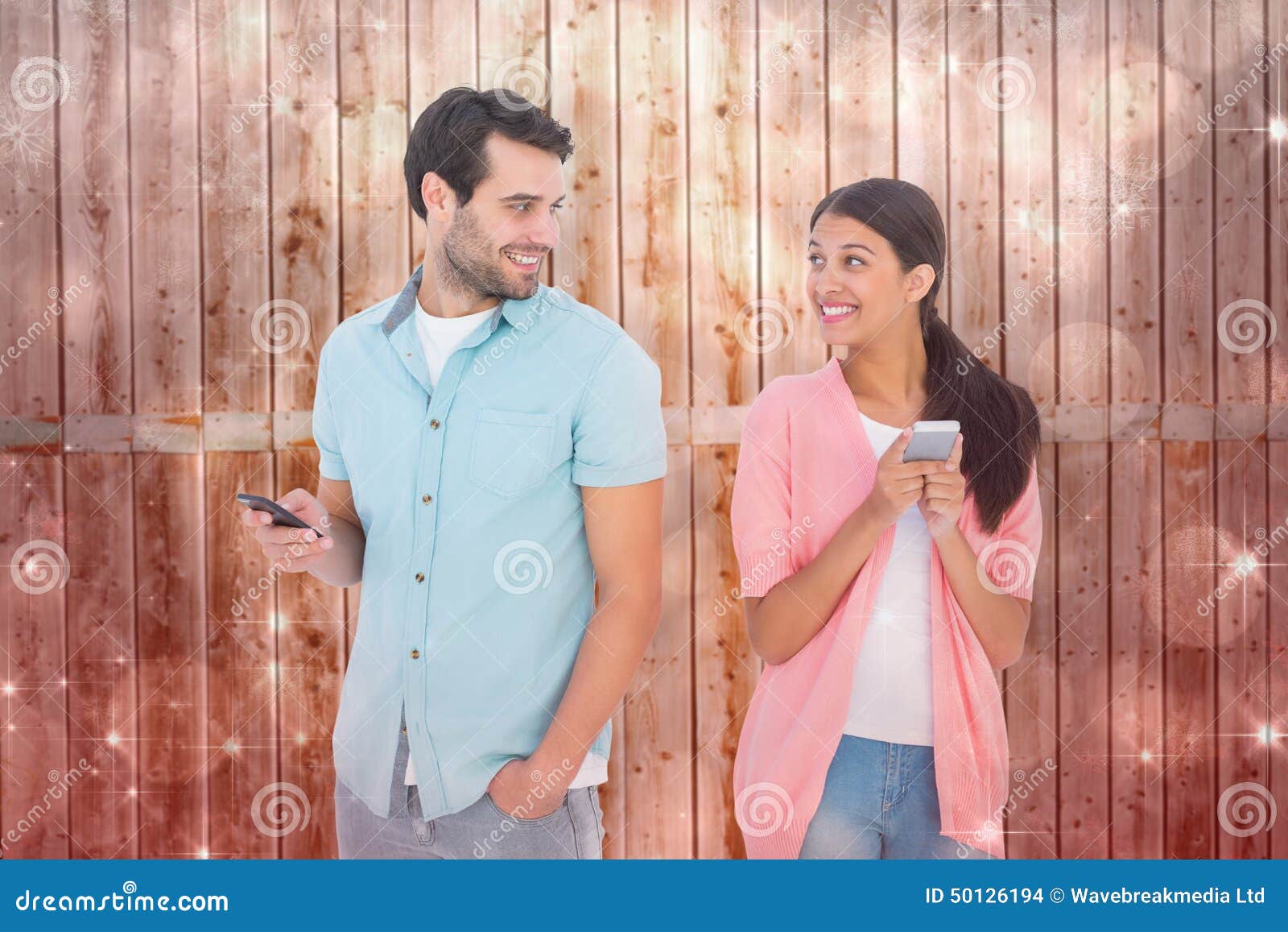 Composite Image of Happy Couple Sending Text Messages Stock Photo ...