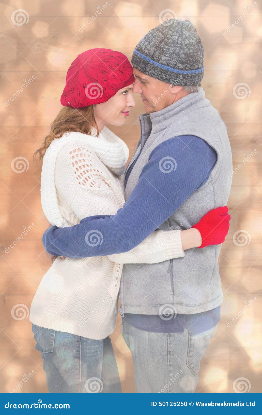 Composite Image of Happy Couple in Warm Clothing Hugging Stock Photo ...