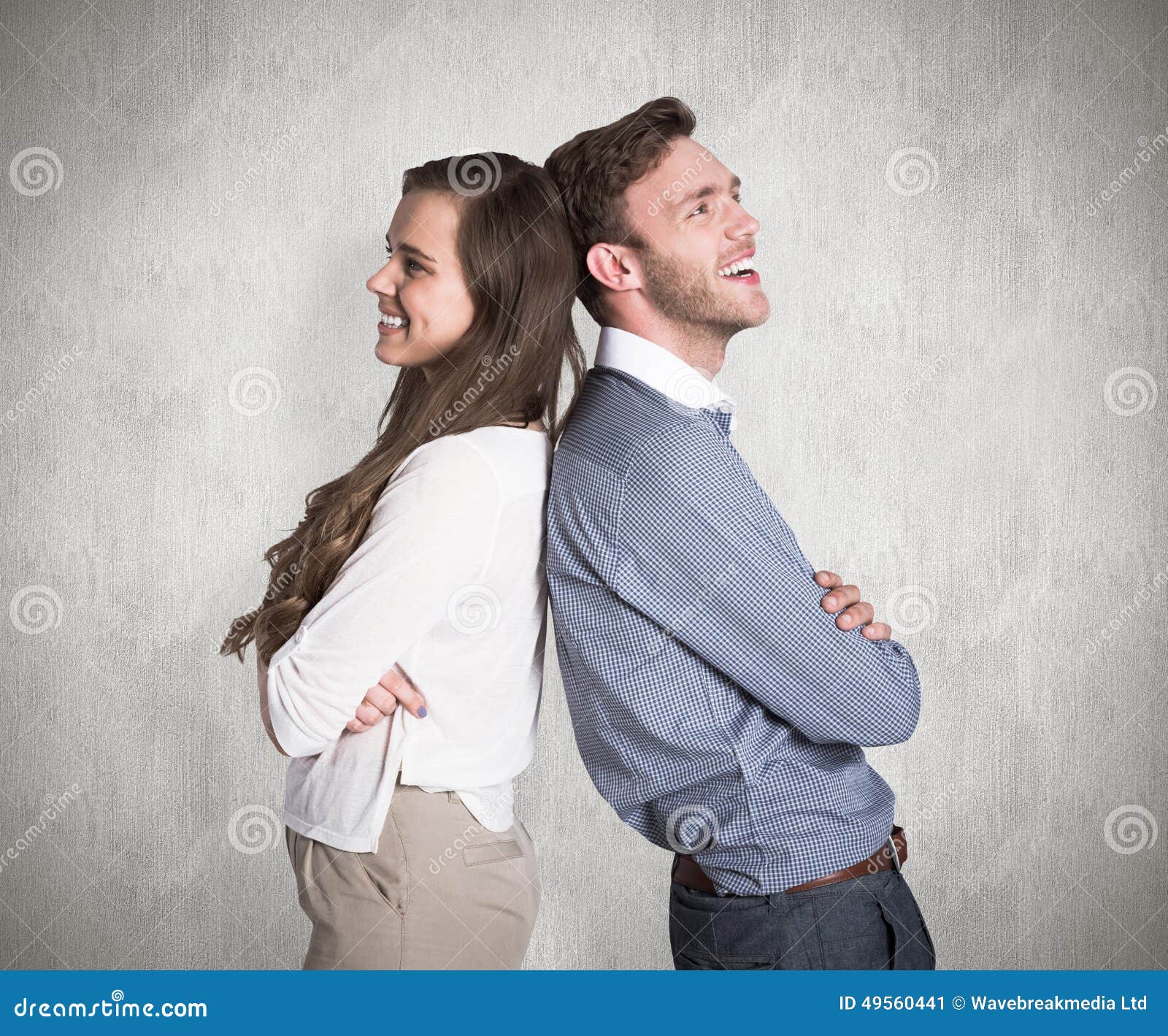 Composite Image of Happy Young Couple Standing Back To Back Stock Image ...