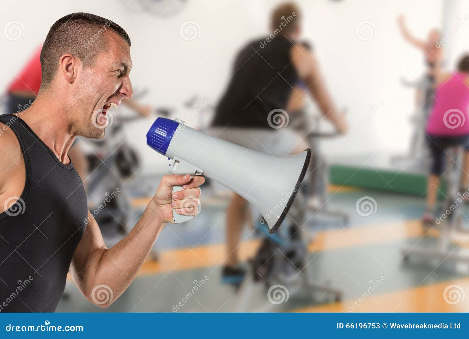 Composite Image of Irritated Male Trainer Yelling through Megaphone ...