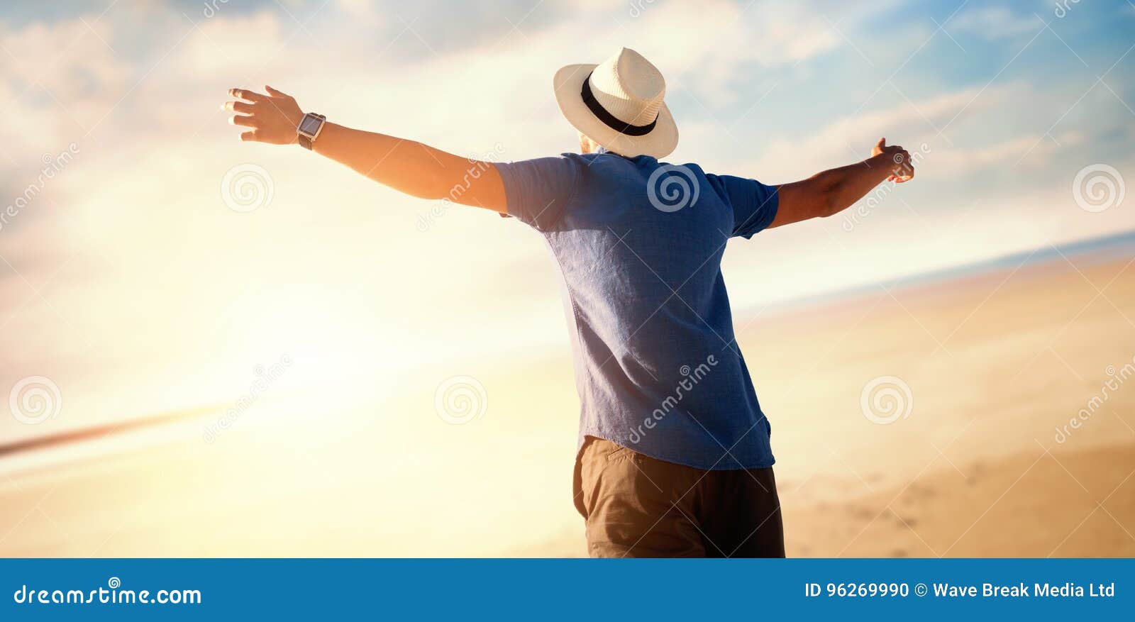 Composite Image of Low Angle of a Man Raising Arms Up Stock Photo ...