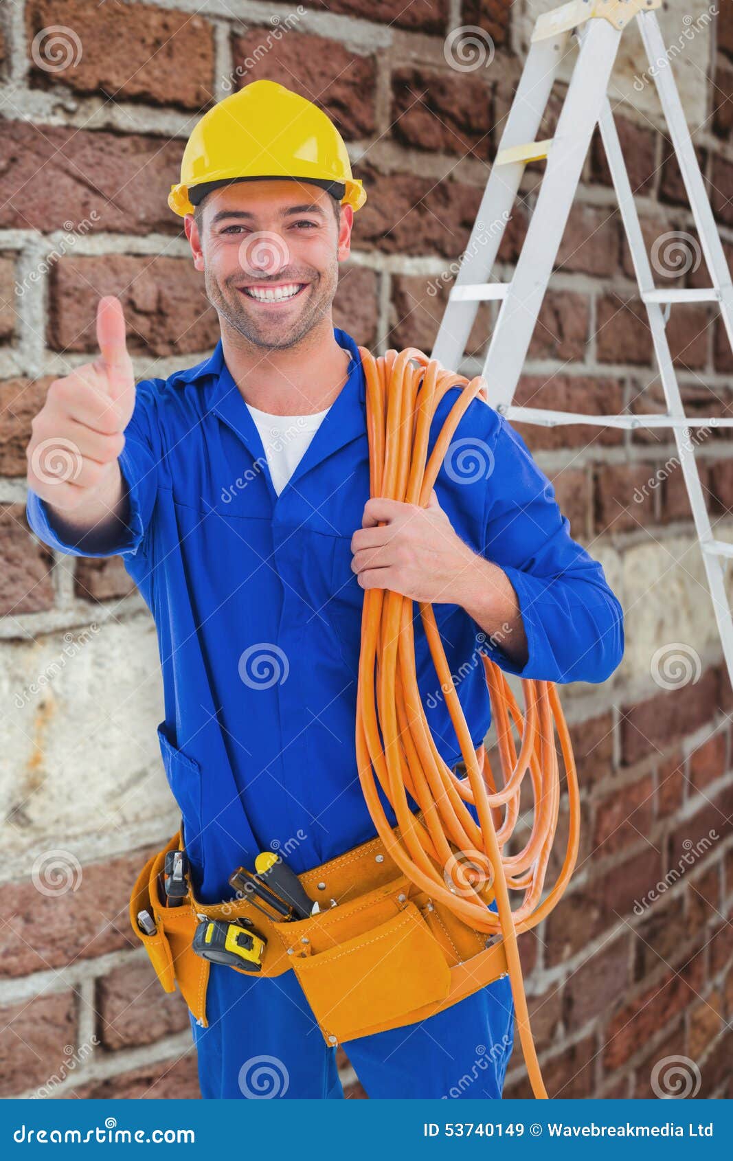 Composite Image of Male Technician with Wire Roll Gesturing Thumbs Up ...