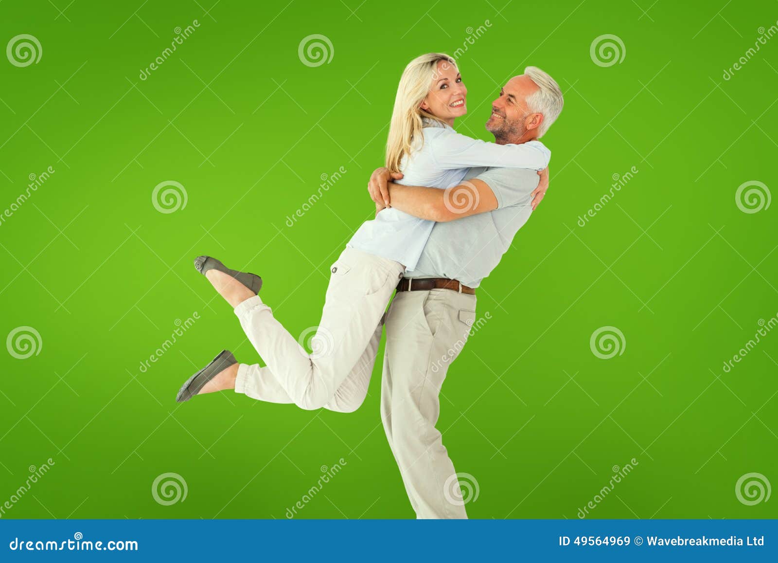 Composite Image of Man Picking Up His Partner while Hugging Here Stock ...