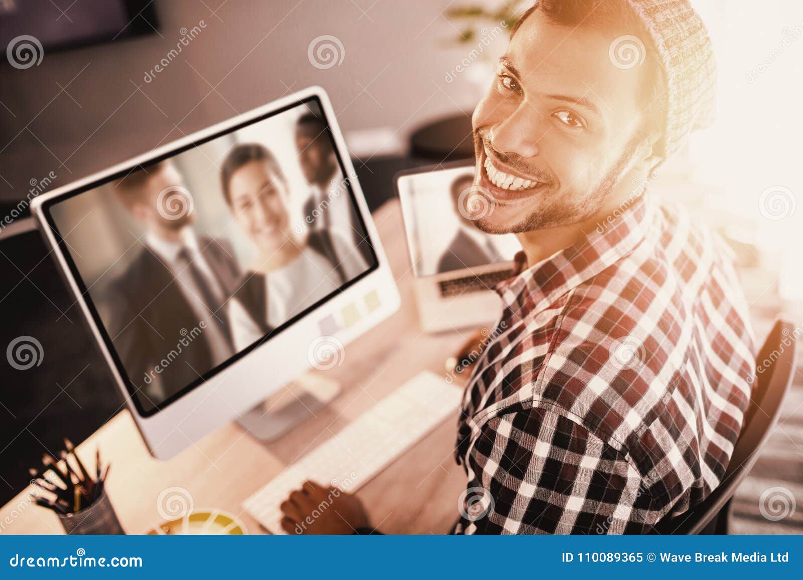 Composite Image of Portrait of Man Smiling while Sitting by Computer ...