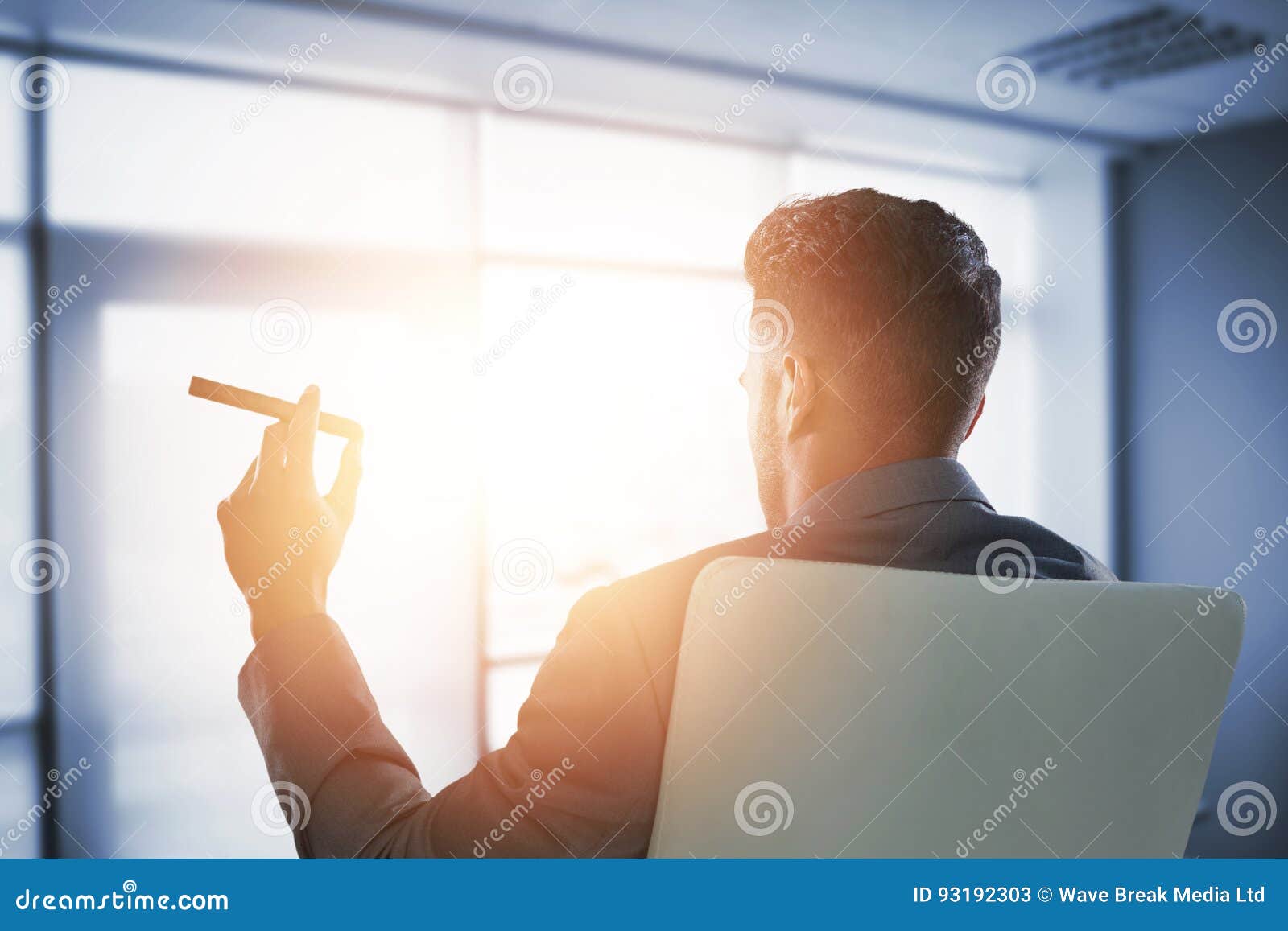 Composite Image Of Rear View Of Businessman Holding Cigar Stock Image