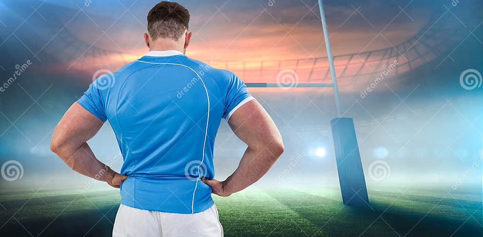 Composite Image of Rugby Player with Hands on Hips Stock Image - Image ...