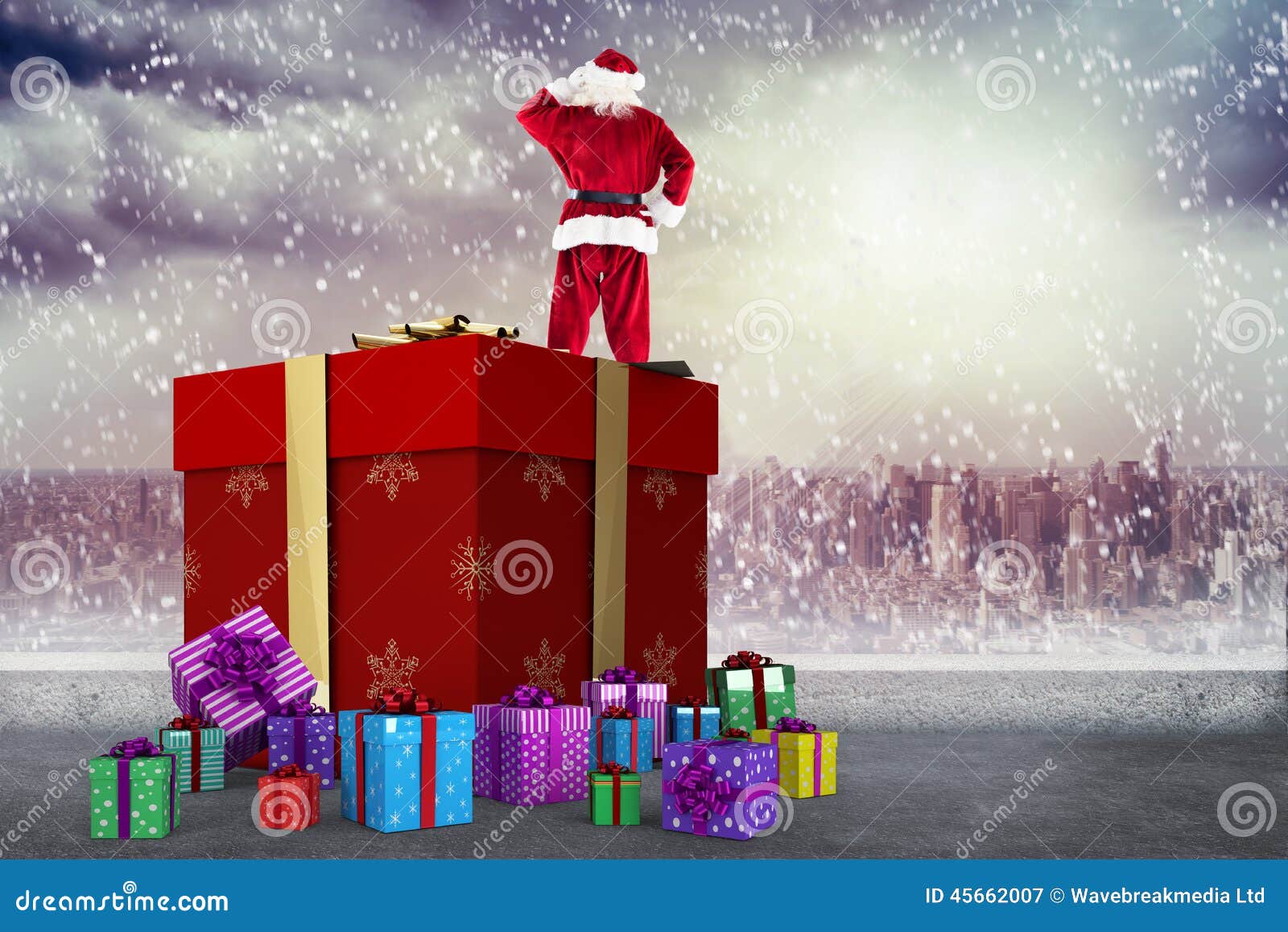 Composite Image of Santa Standing on Giant Present Stock Image - Image ...