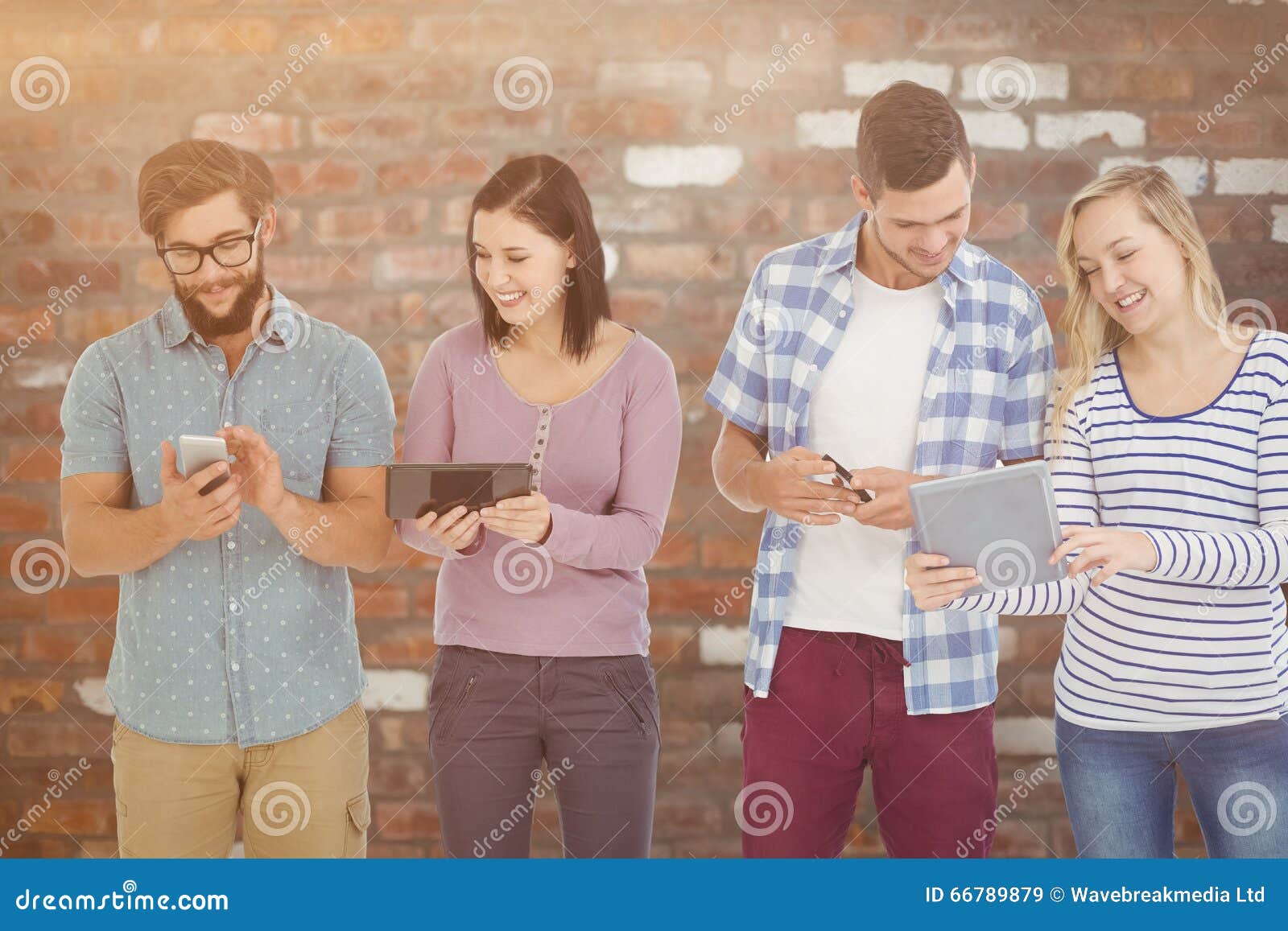 Composite Image of Smiling Business People Using Electronic Gadgets ...