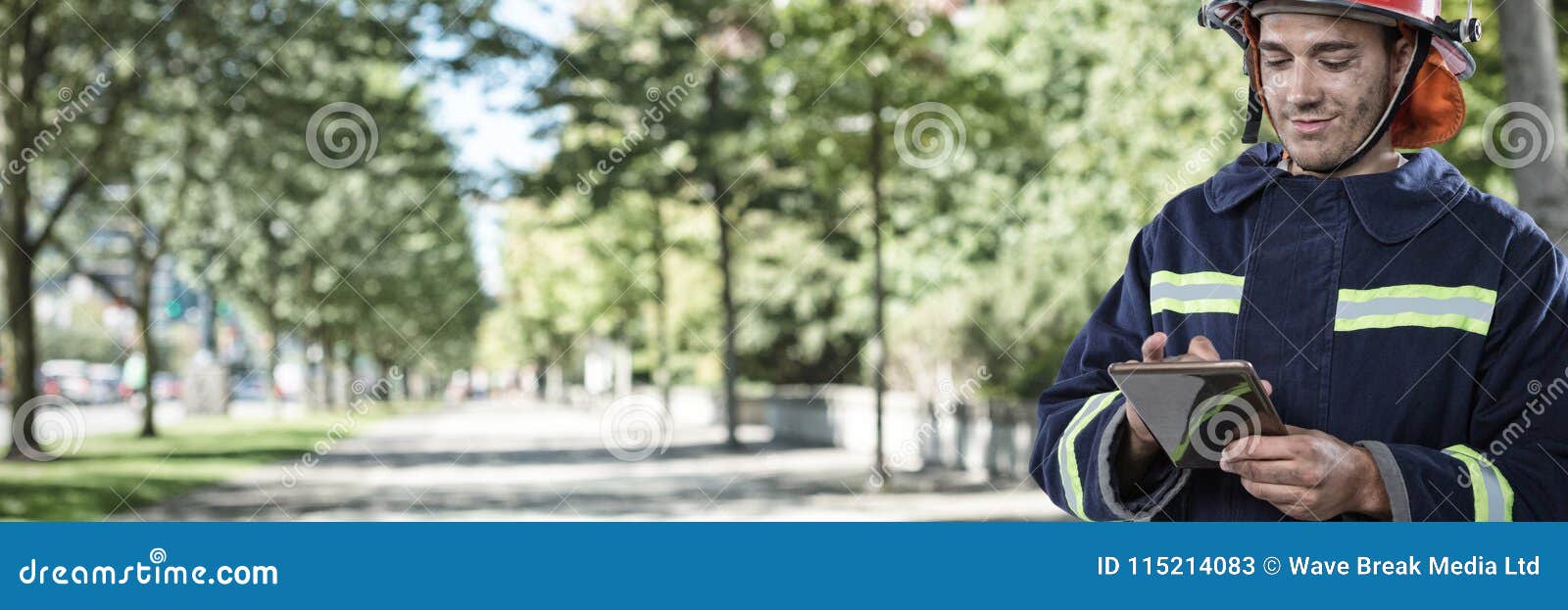 Composite Image of Smiling Fireman Using Tablet Stock Image - Image of ...