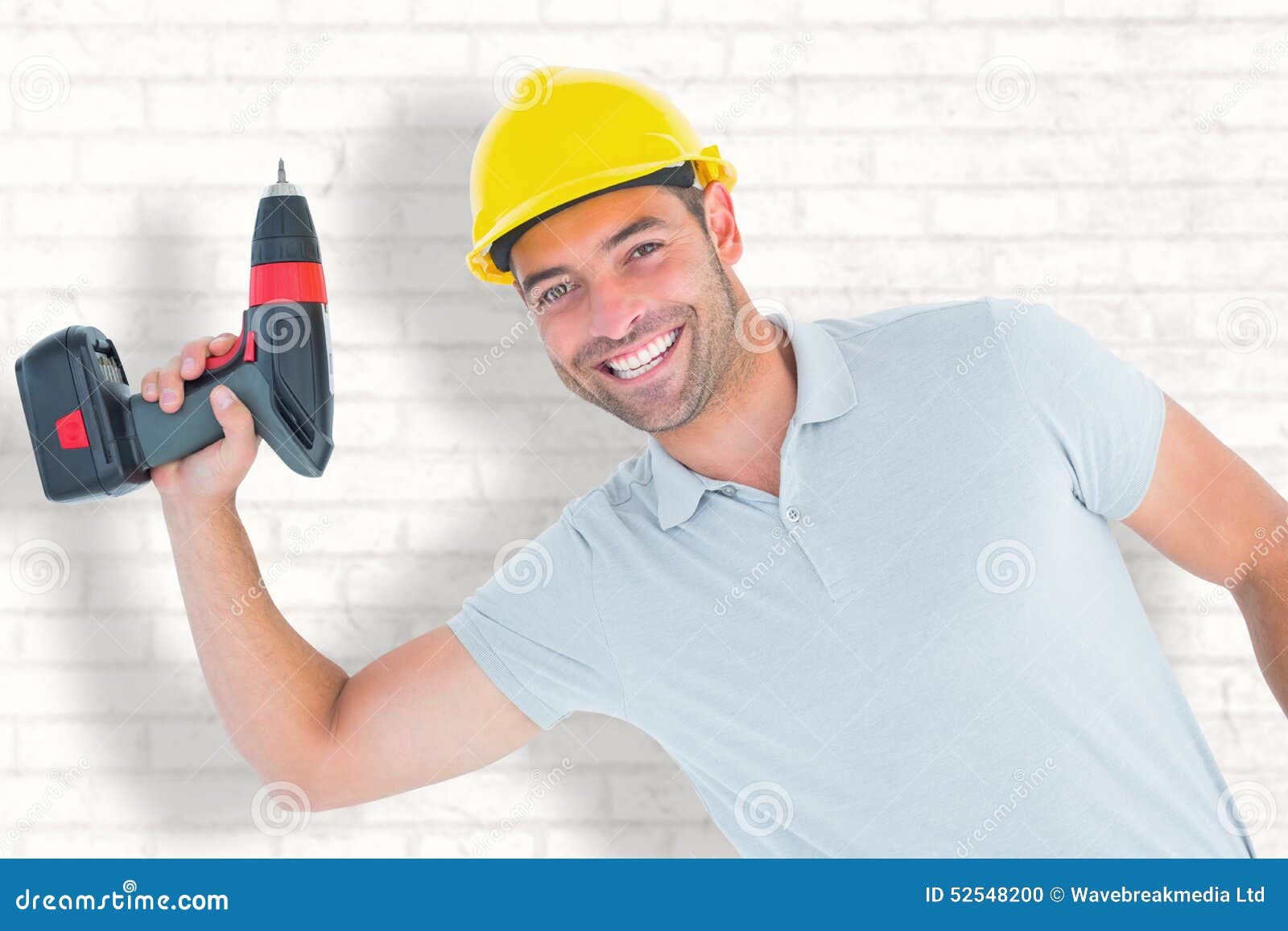 Composite Image of Smiling Repairman Holding Power Drill Stock Photo ...