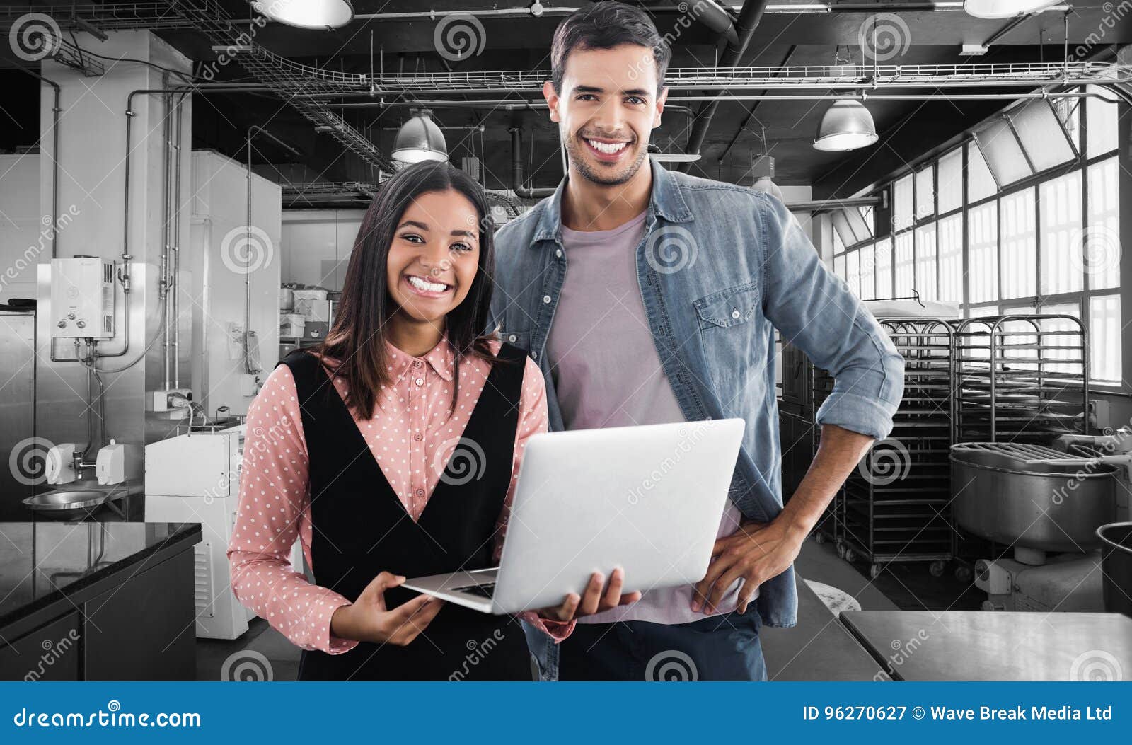 Composite Image of Smiling Teamwork Looking at Camera Stock Image ...