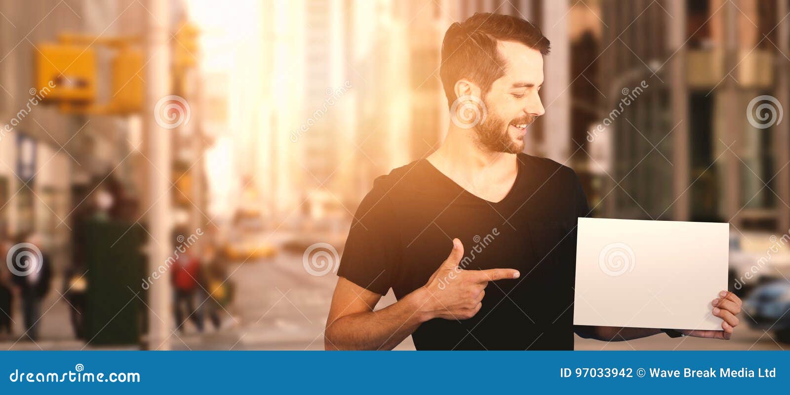Composite Image of Smiling Young Man Pointing Towards Blank Cardboard ... Composite Image of Smiling Young Man Pointing Towards Blank Cardboard ...