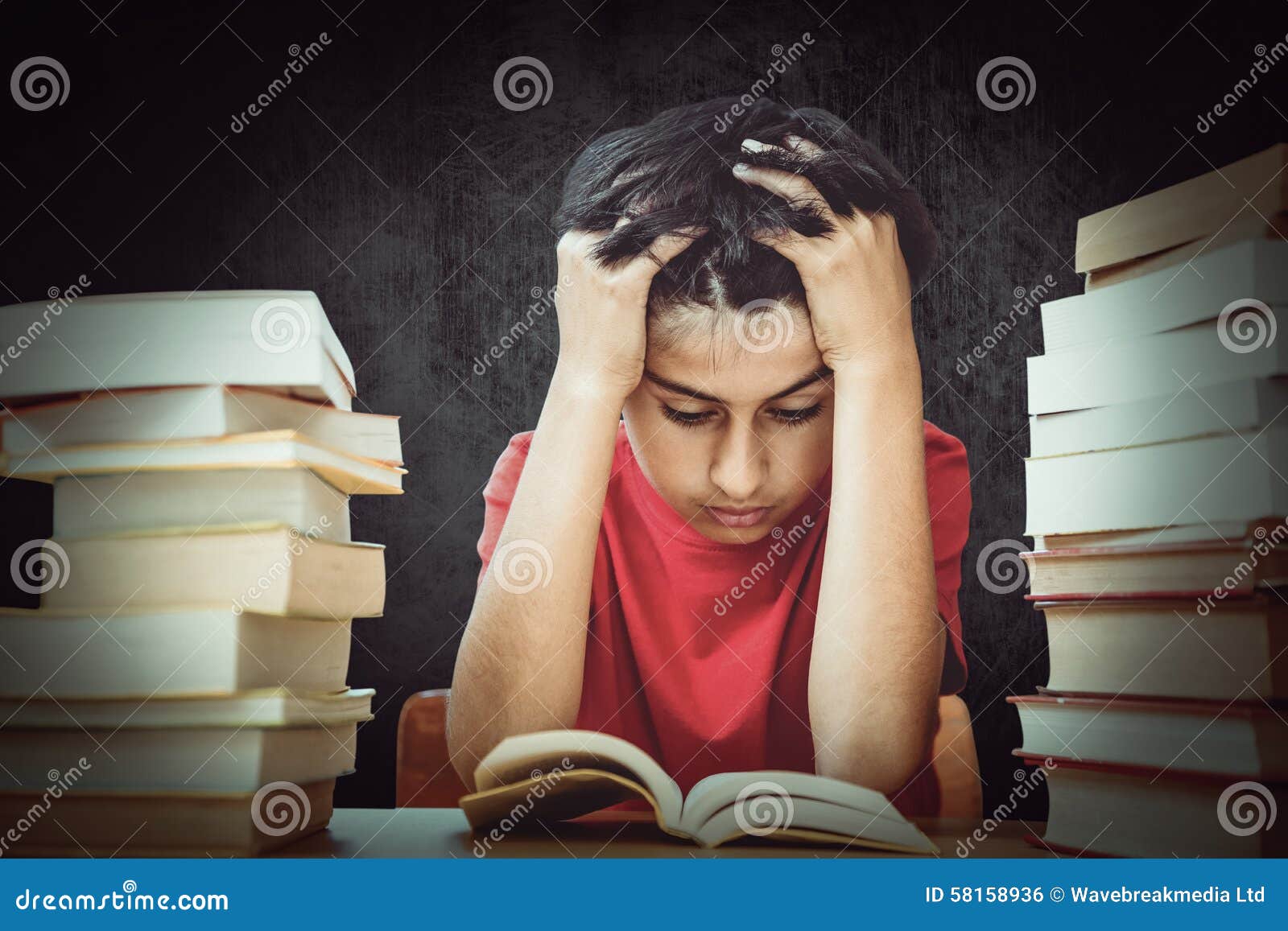 Composite Image of Tensed Boy Sitting with Stack of Books Stock Photo ...
