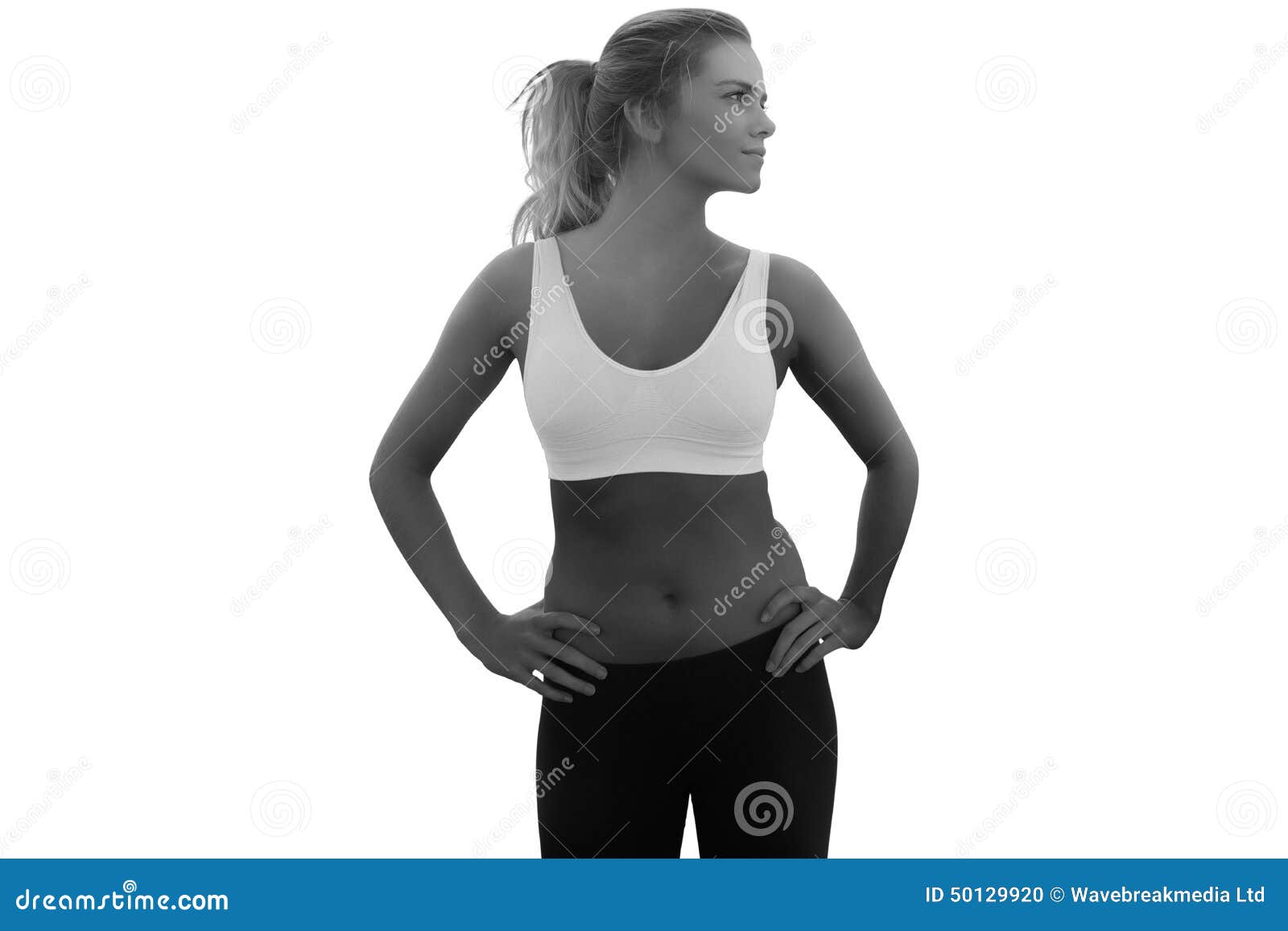 Composite Image of Toned Woman with Hands on Hips on Beach Stock Photo ...