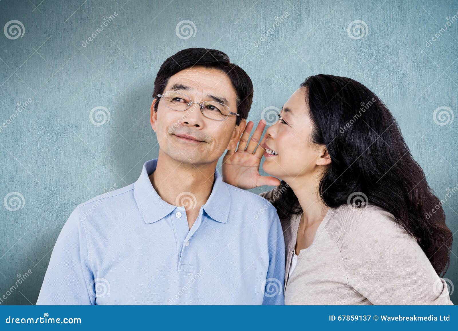 Composite Image of Woman Whispering into Partners Ear Stock Image ...