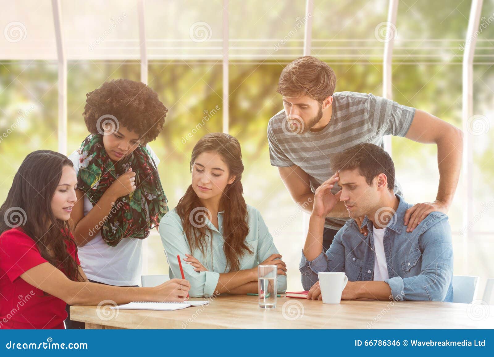 Composite Image of Young Colleagues in Discussion at Office Stock Photo ...