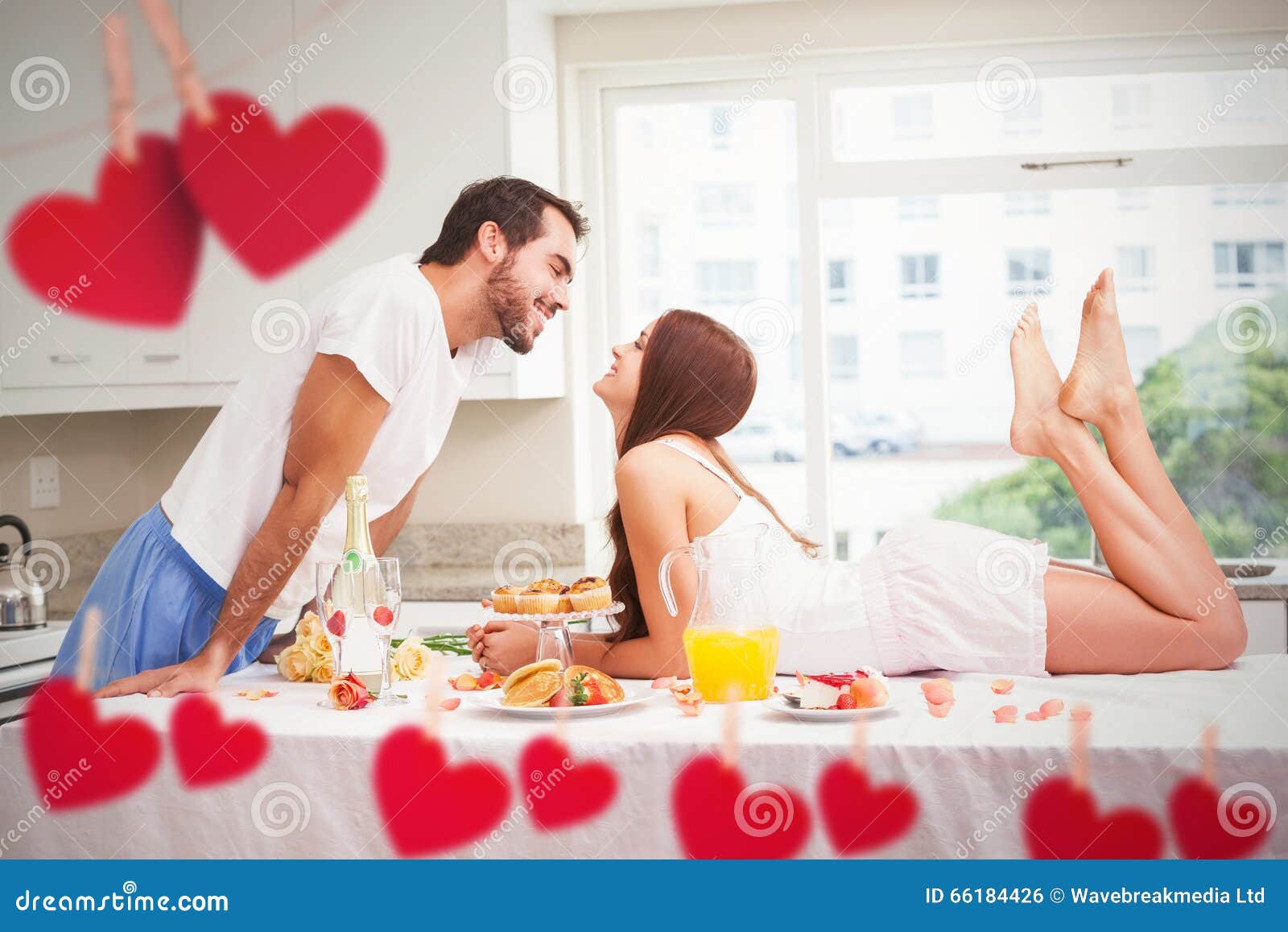 Composite Image of Young Couple Having a Romantic Breakfast Stock Photo ...