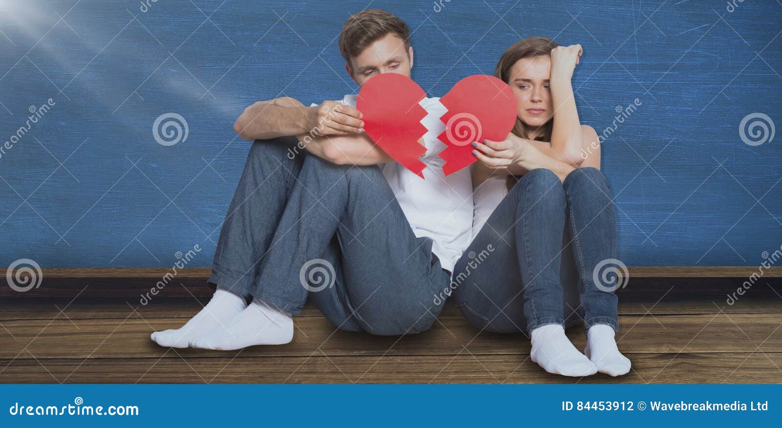 Composite Image of Young Couple Holding Broken Heart Stock Photo ...