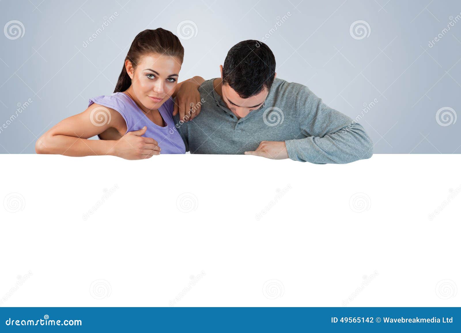 Composite Image of Young Couple Looking Over a Wall Stock Photo - Image ...