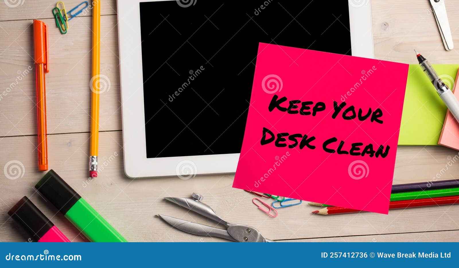 Composite of Keep Your Desk Clean Text on Sticky Note with Digital ... Composite of Keep Your Desk Clean Text on Sticky Note with Digital ...