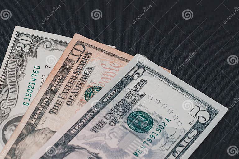 Composition of All US Dollar Notes Stacked on a Black Background with ...