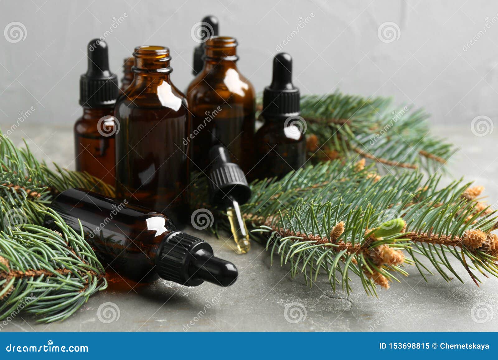 Composition with Bottles of Conifer Essential Oil Stock Image - Image ...