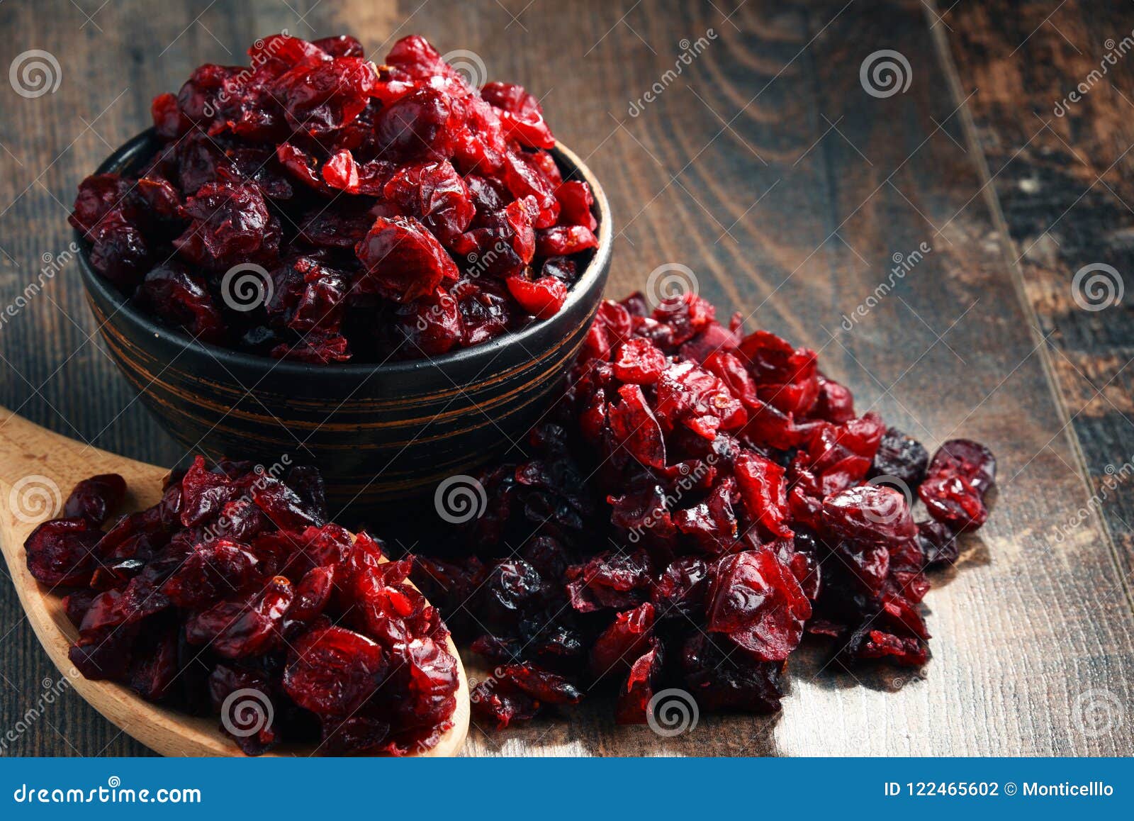Composition with Bowl of Dried Cranberries on Wooden Table Stock Photo ...