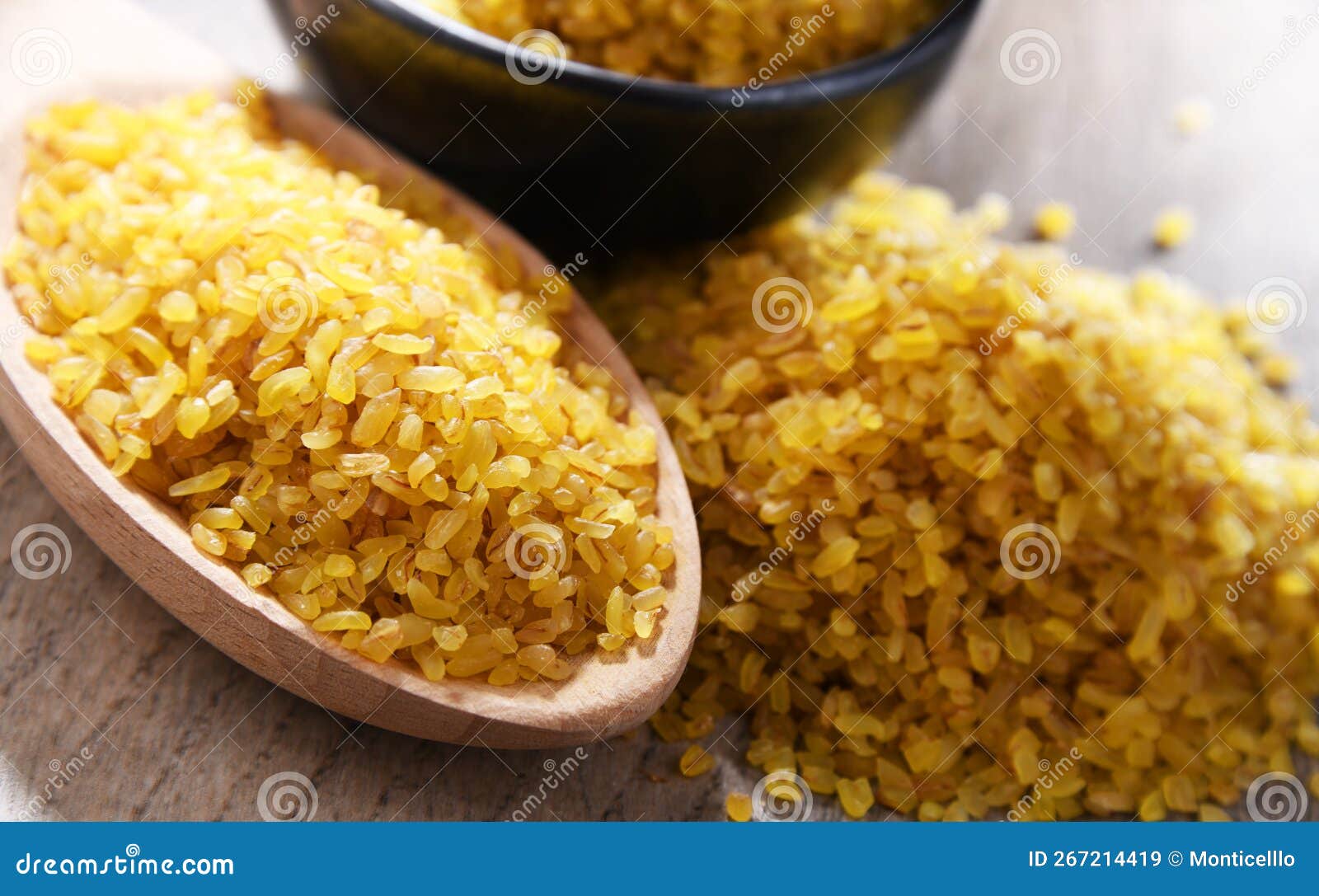 Composition with a Bowl and Spoon of Uncooked Bulgur on a Table Stock ...