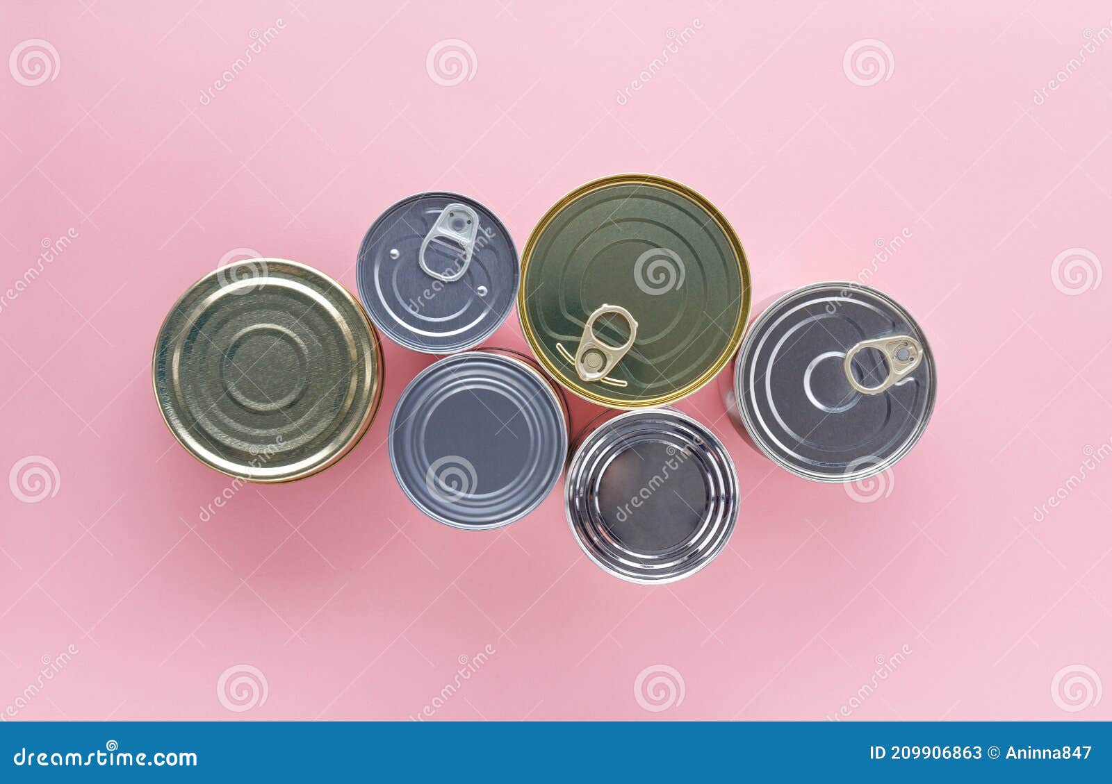 Composition of Closed Tin Cans of Different Sizes on a Pink Background ...