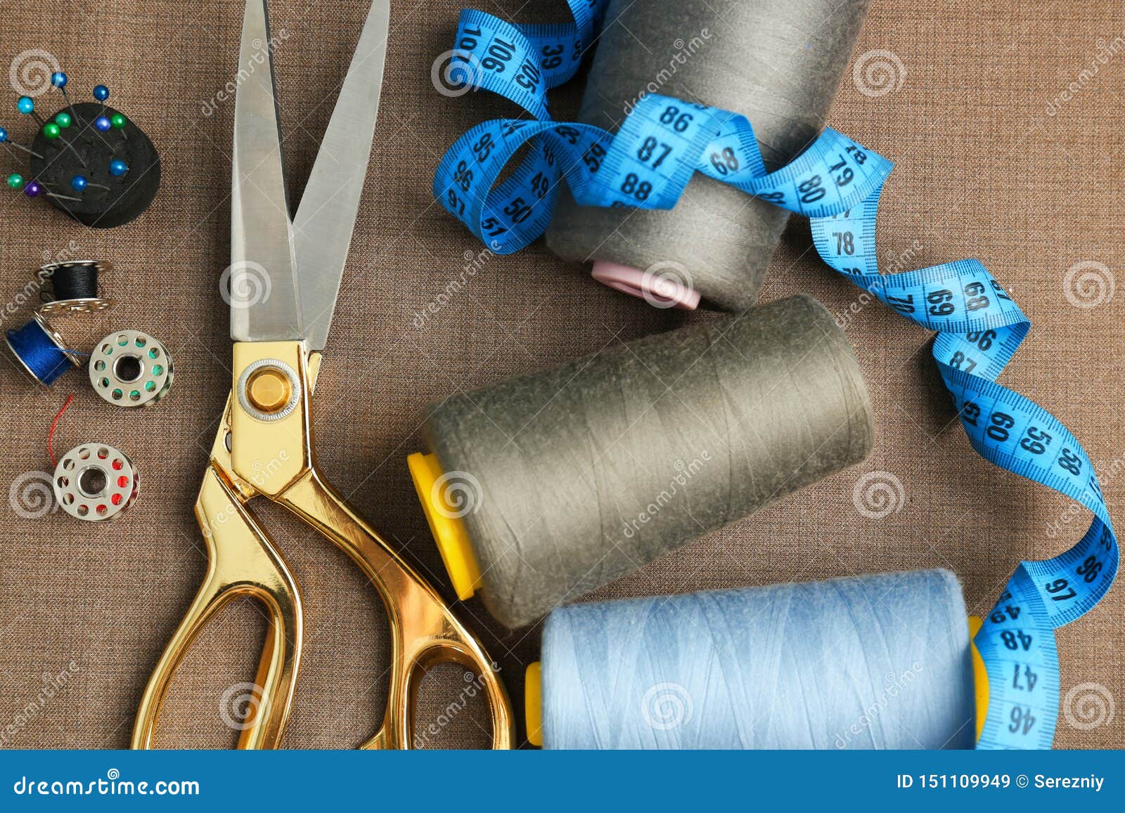 Composition with Color Threads and Sewing Accessories on Fabric Stock ...