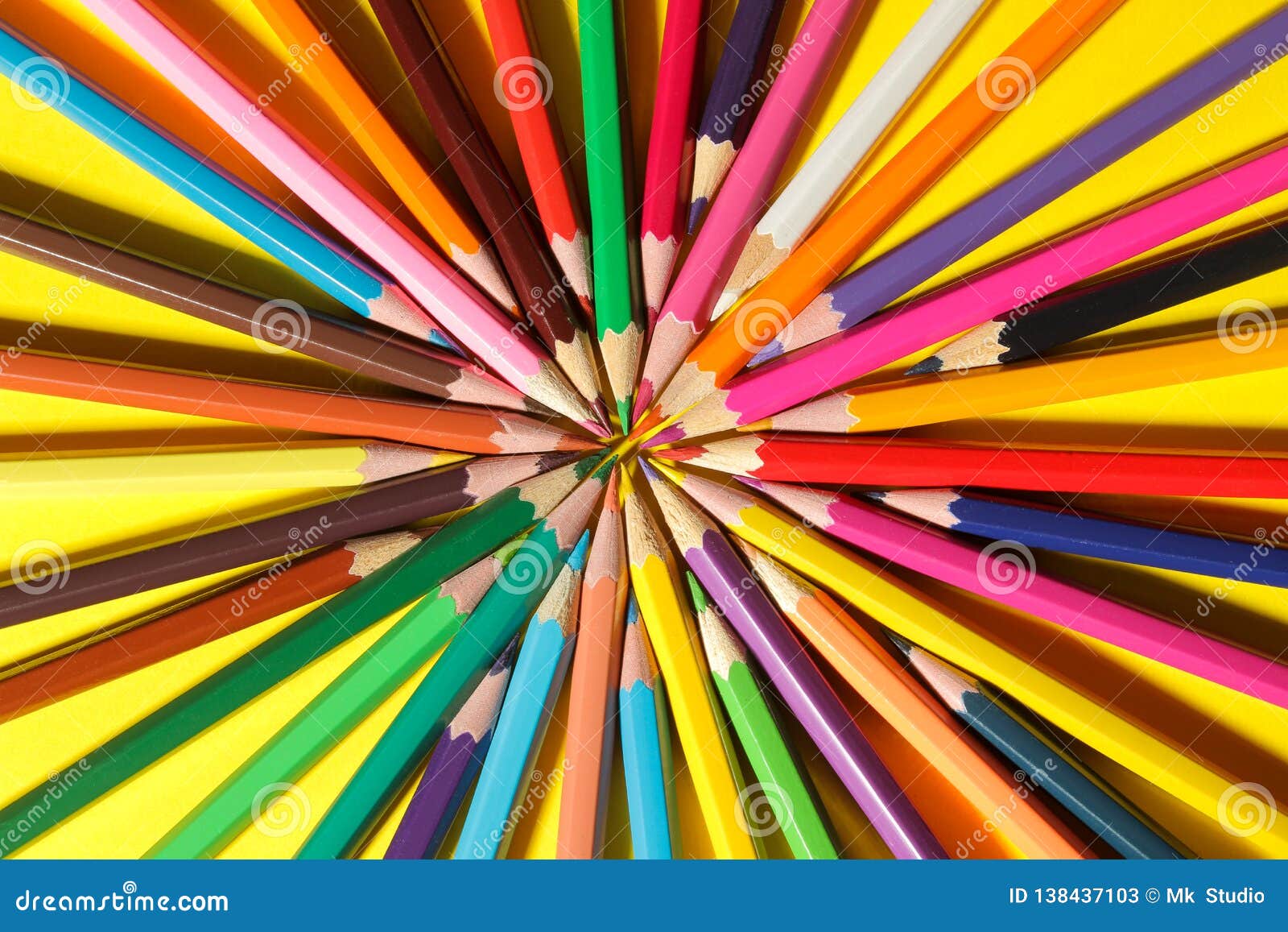 Composition with Colored Pencils on a Bright Yellow Background. Close ...