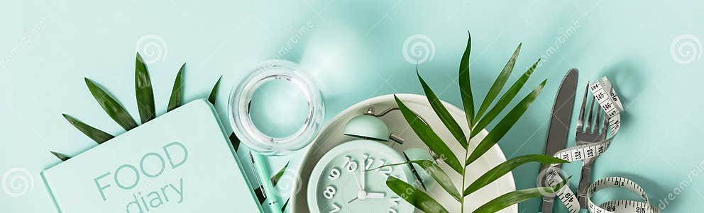 Composition with Cutlery, Measuring Tape, Food Diary and Alarm Clock on ... Composition with Cutlery, Measuring Tape, Food Diary and Alarm Clock on ...
