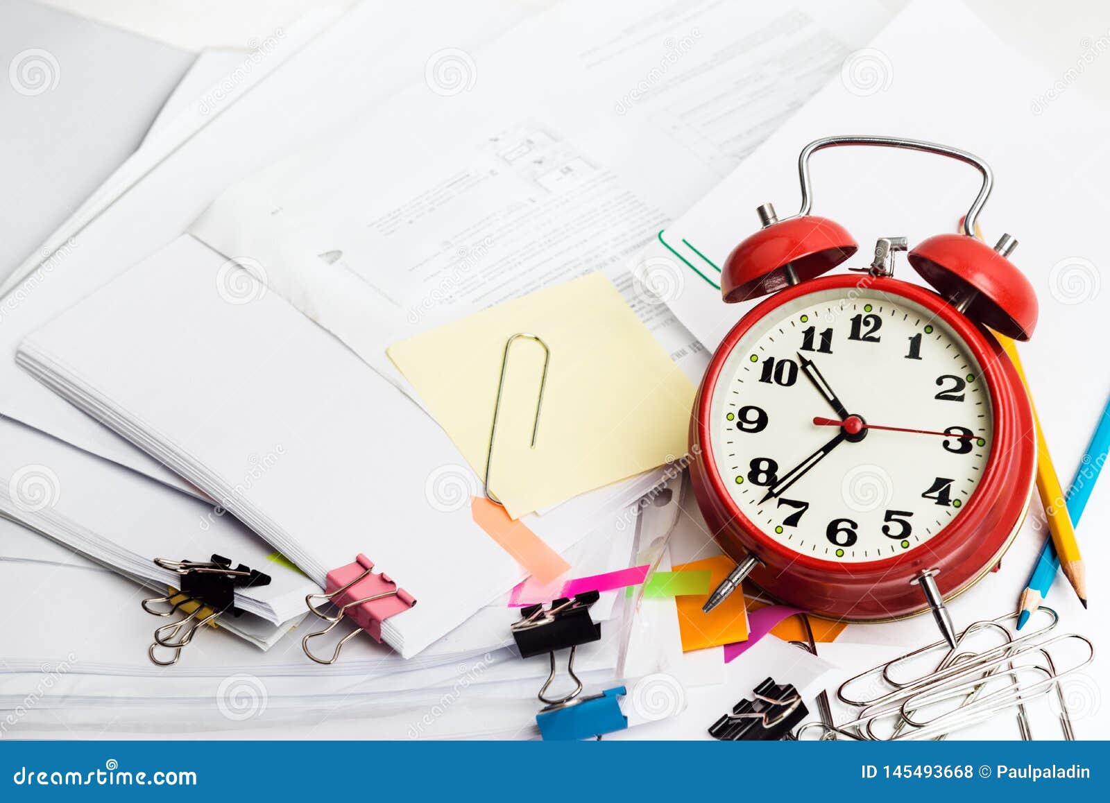 Composition with Documents, Stationary and Alarm Clock on Table Stock ...