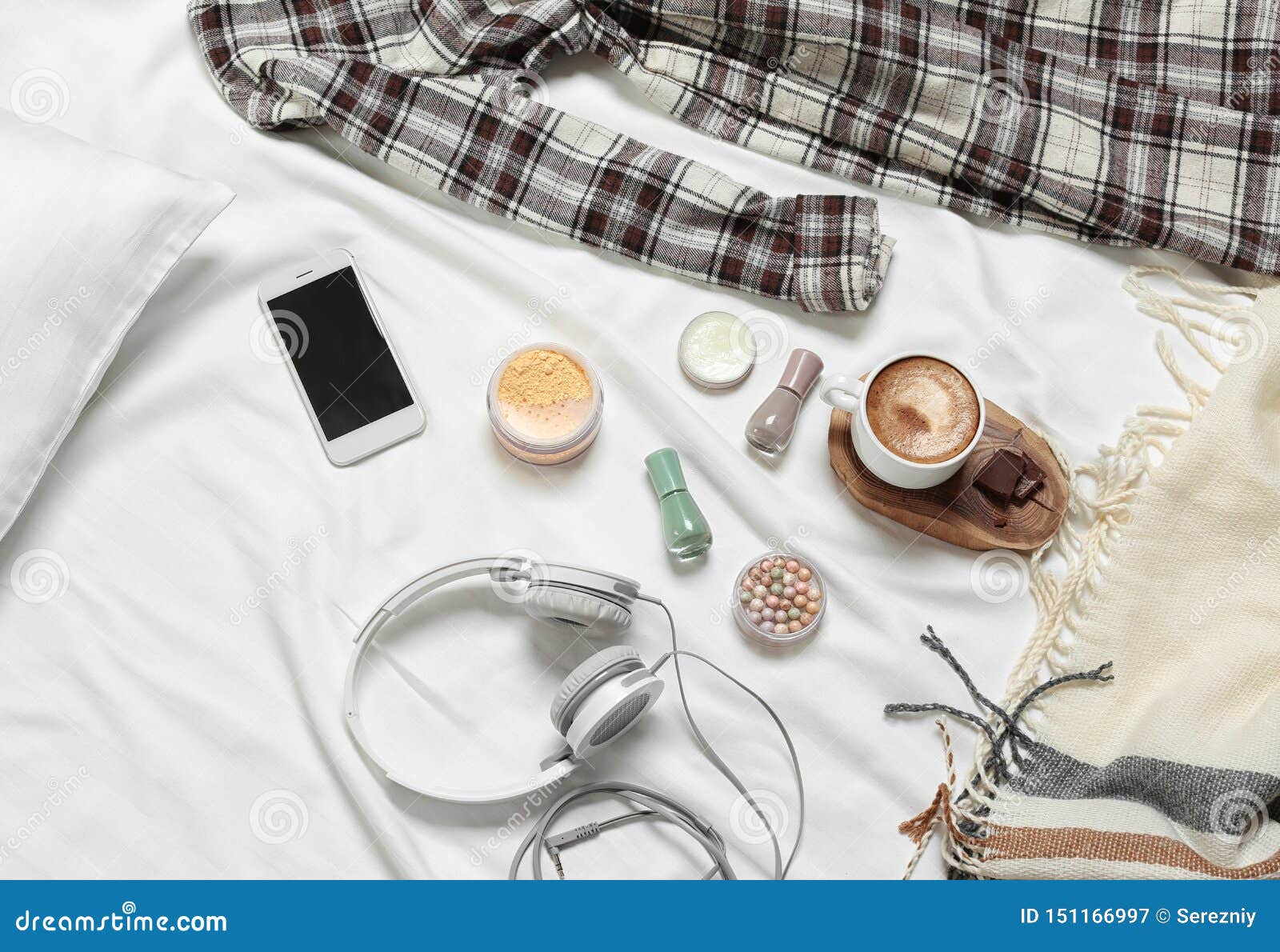 Composition with Female Clothes, Cosmetics and Phone on Bed Linen Stock ...