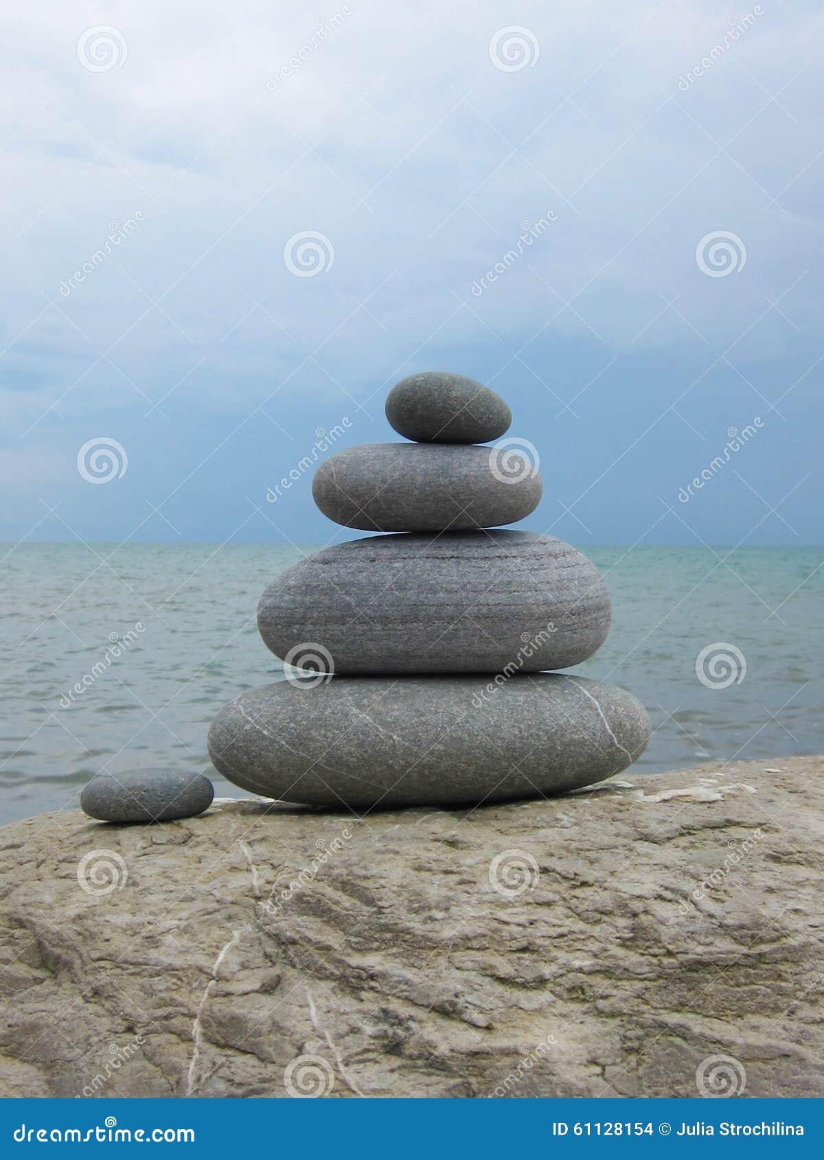 A Composition of Five Stones on a Rock Against the Background O Stock ...