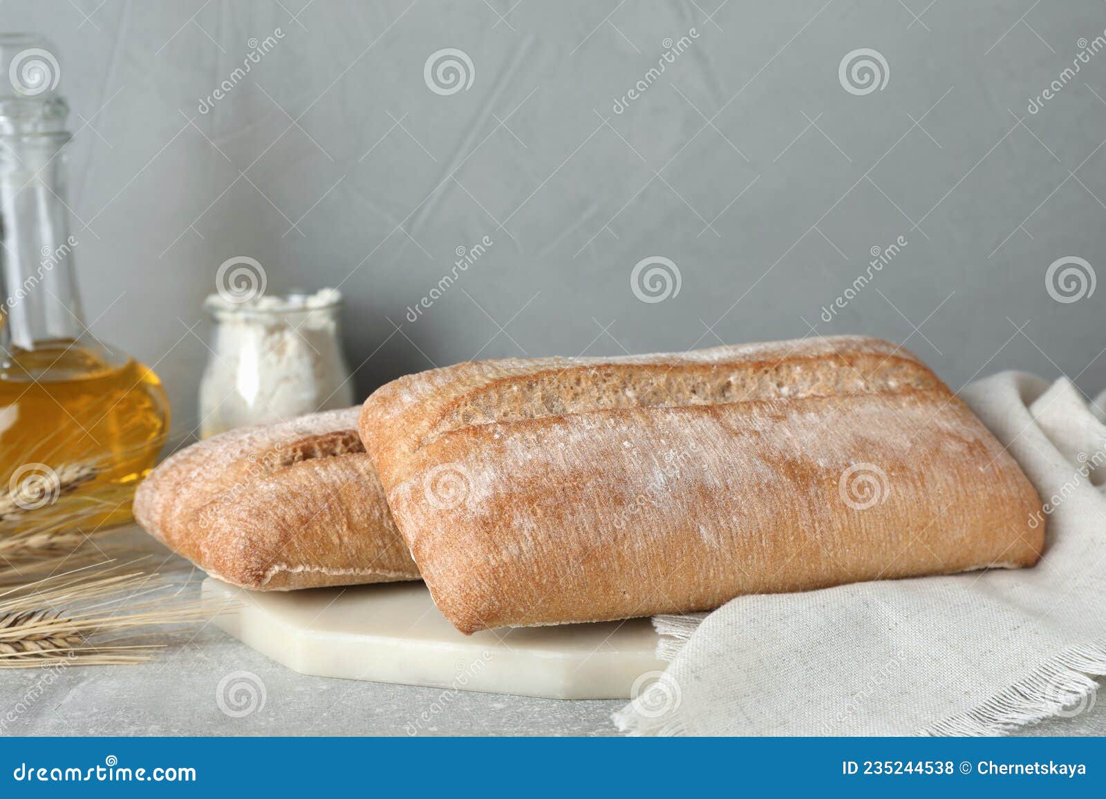 Composition with Fresh Crispy Ciabattas on Grey Table Stock Photo ...