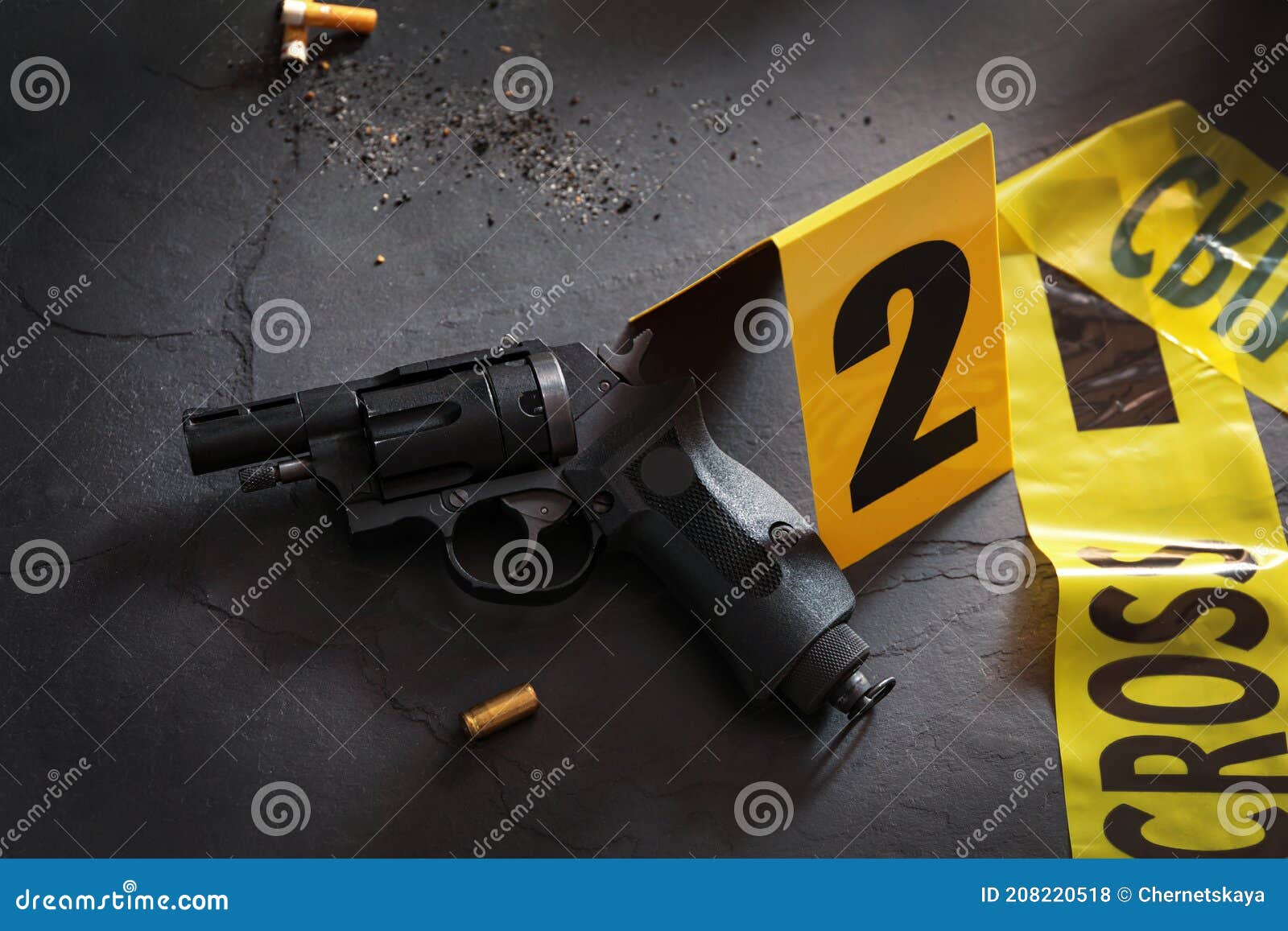 Composition with Gun and Shell Casing on Black Slate Table. Crime Scene ...