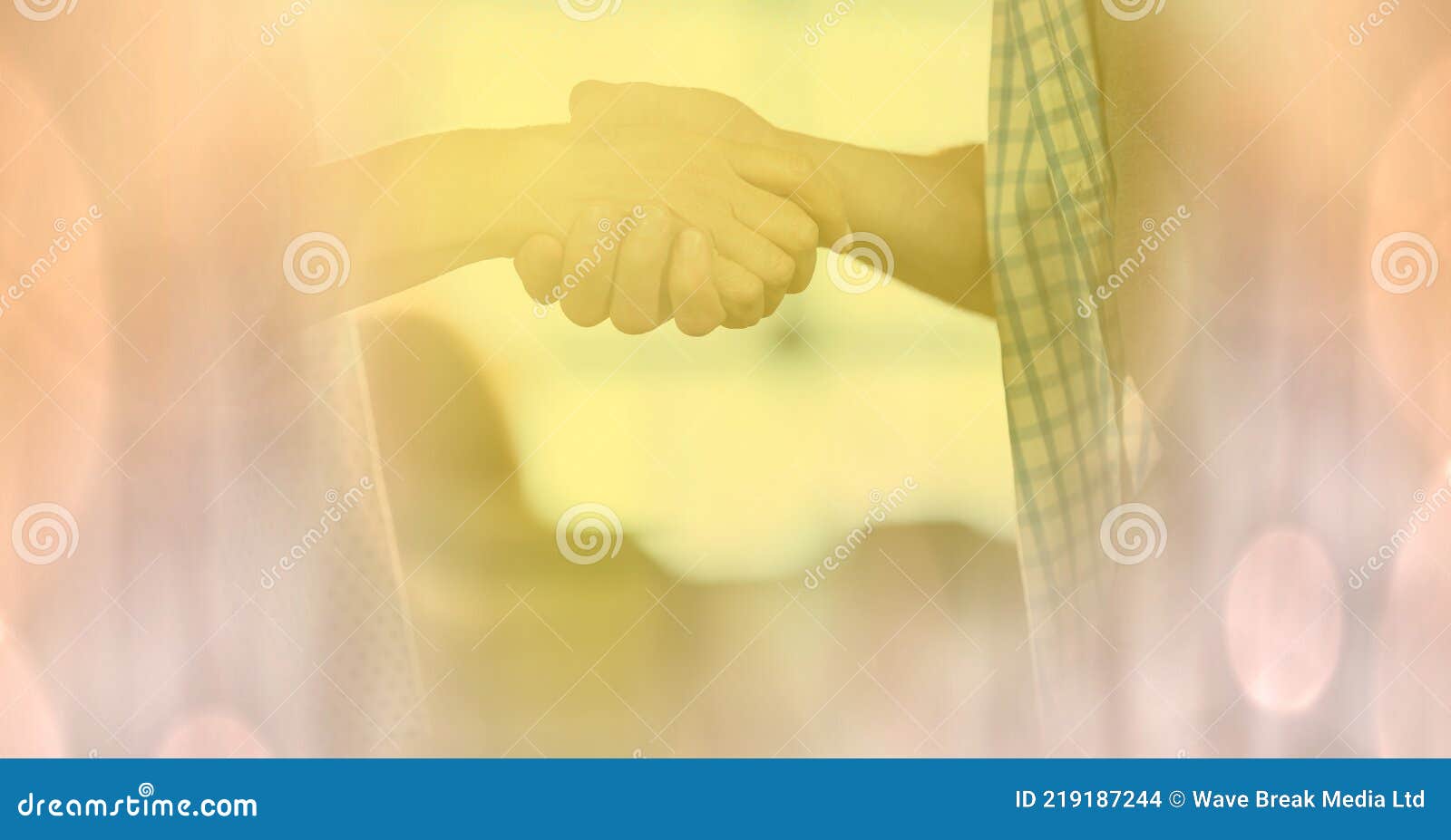 Composition of Handshake with Glowing Yellow Spots of Light Stock Photo ...
