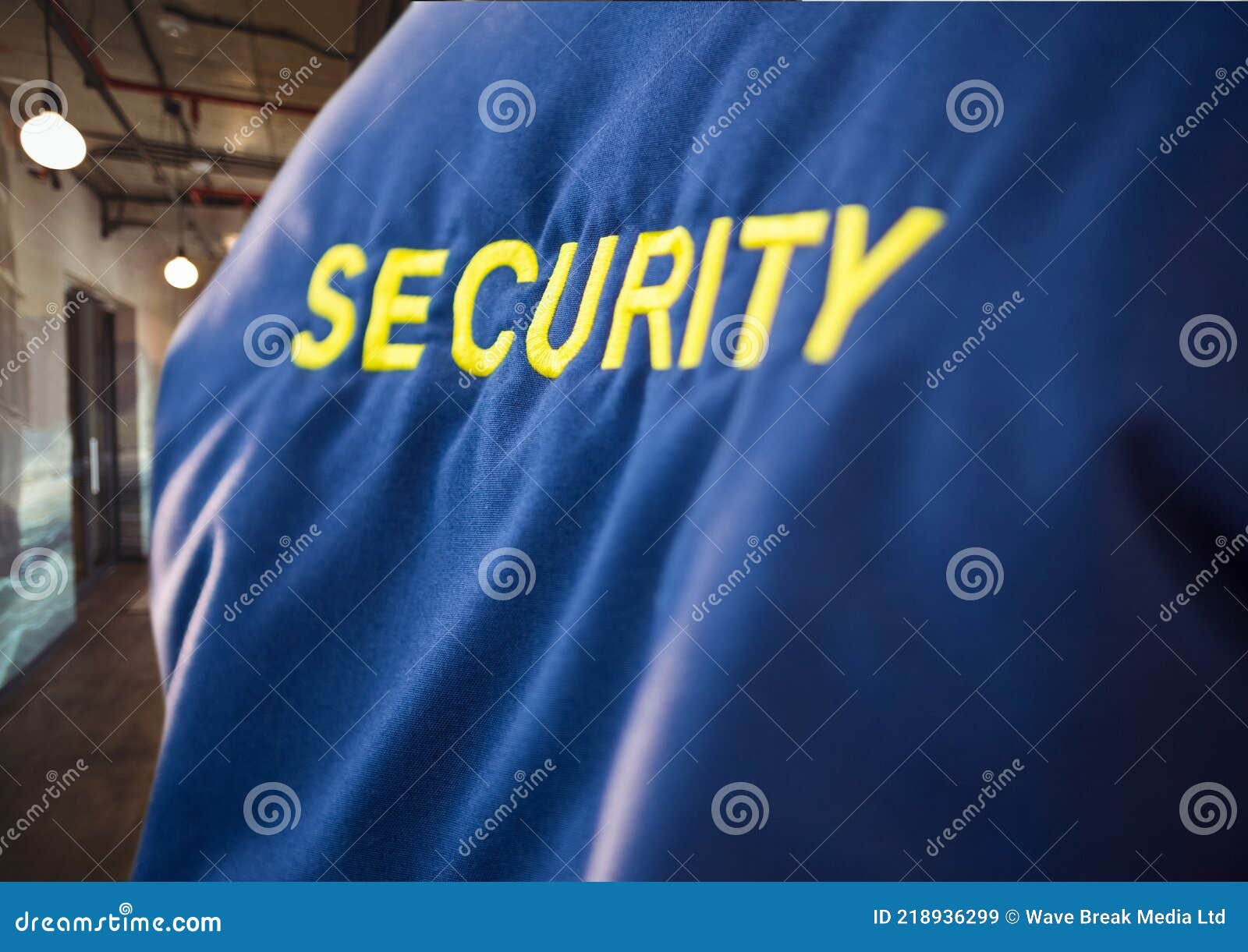 Composition of Midsection of Security Guard Blue Jacket with Yellow ...