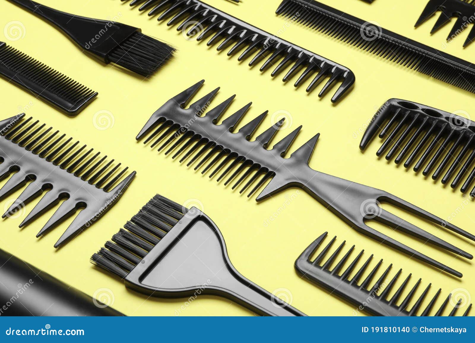 Composition with Modern Hair Combs on Yellow Background Stock Photo ...