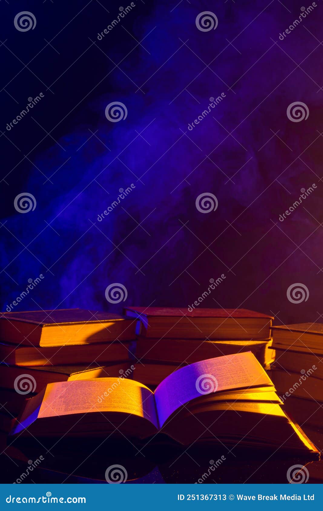 Composition of Multiple Books on Table Over Smoke on Black Background ...