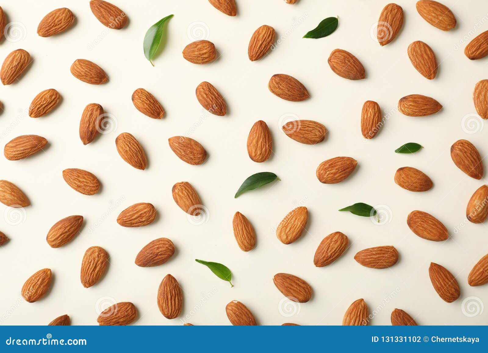 Composition with Organic Almond Nuts on Light Background Stock Photo ...