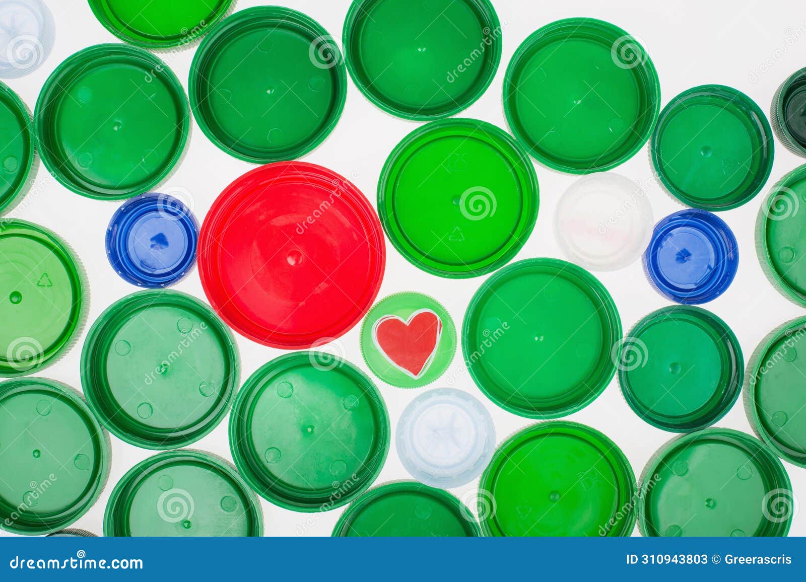 Composition with Plastic Bottle Caps, One Cap with Heart Image Isolated ...