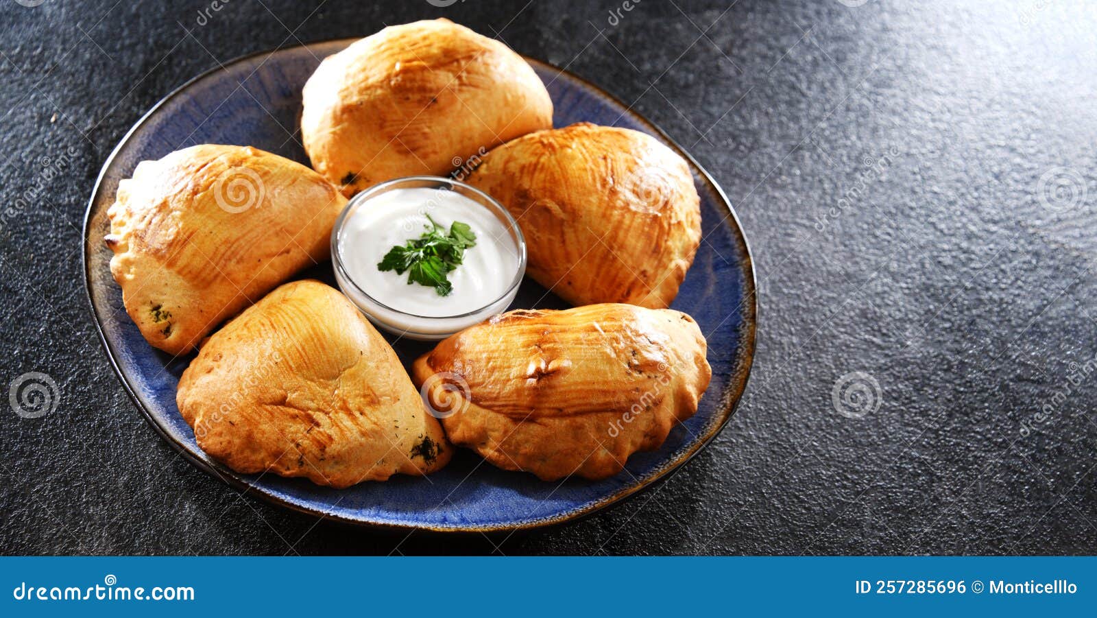 Composition with a Plate of Oven-baked Pierogi Stock Photo - Image of ...